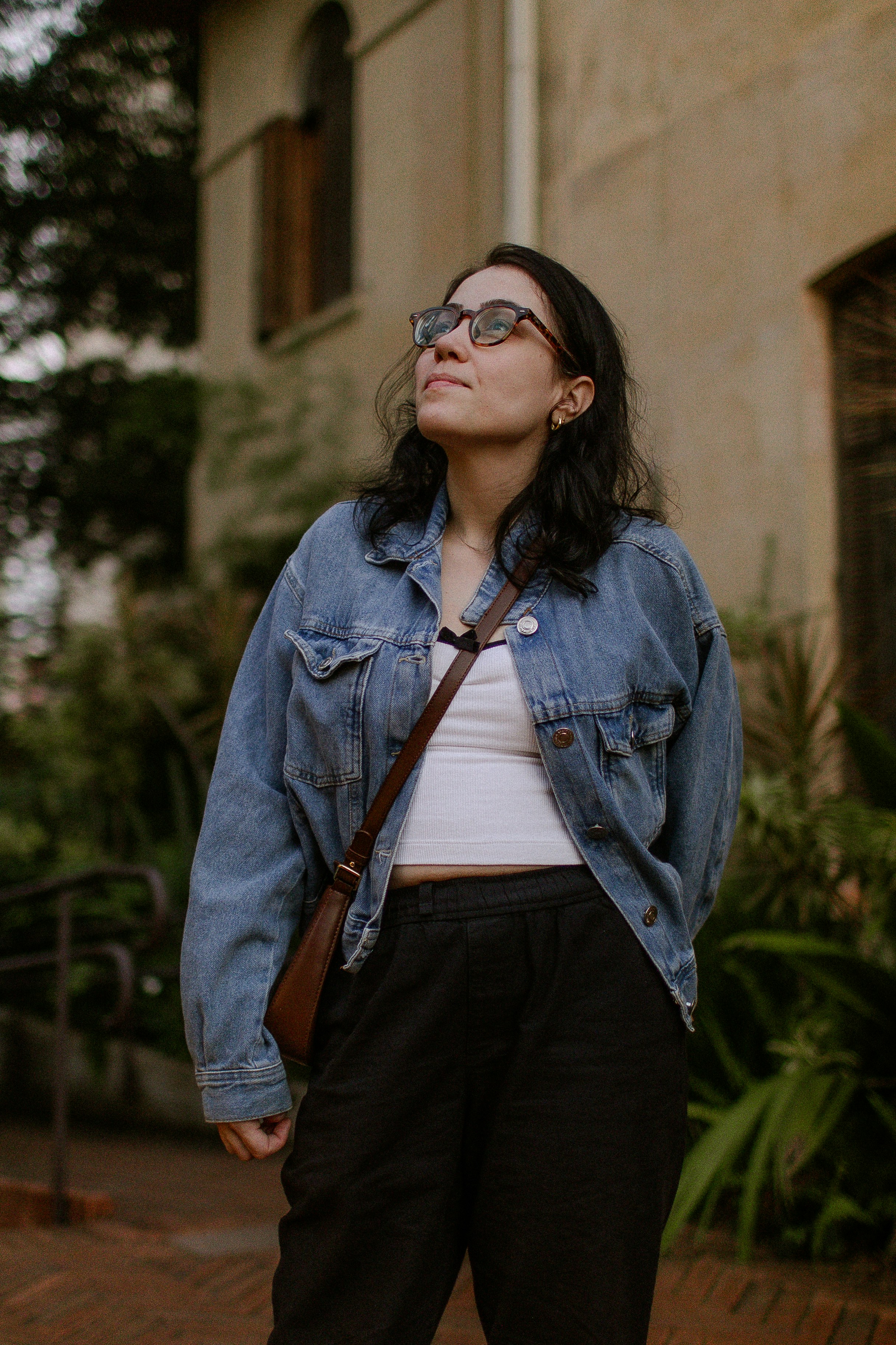 Denim Dialogue: A Confident Portrait Under Soft Urban Light