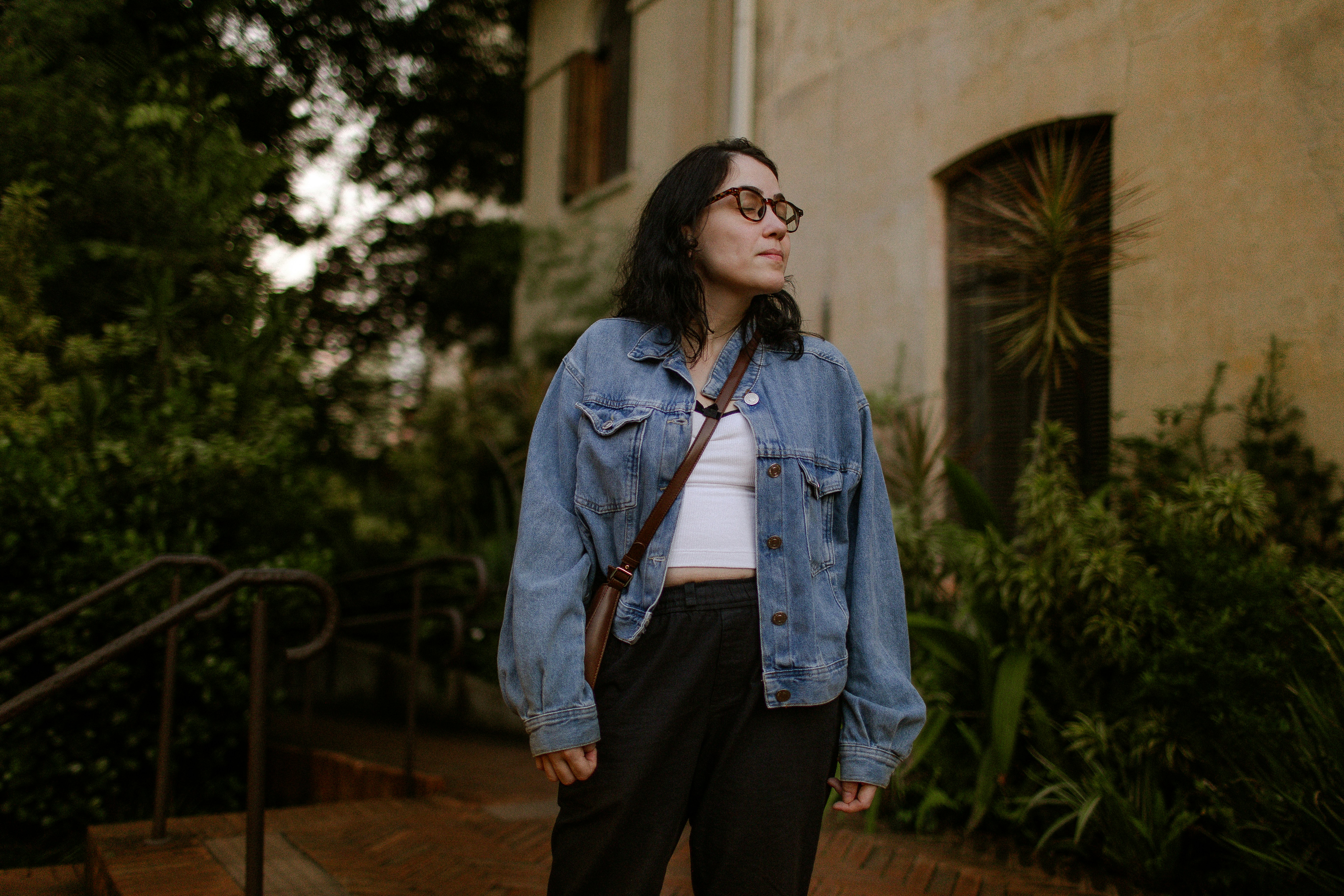 Denim Jacket Confidence: A Woman by the Courtyard