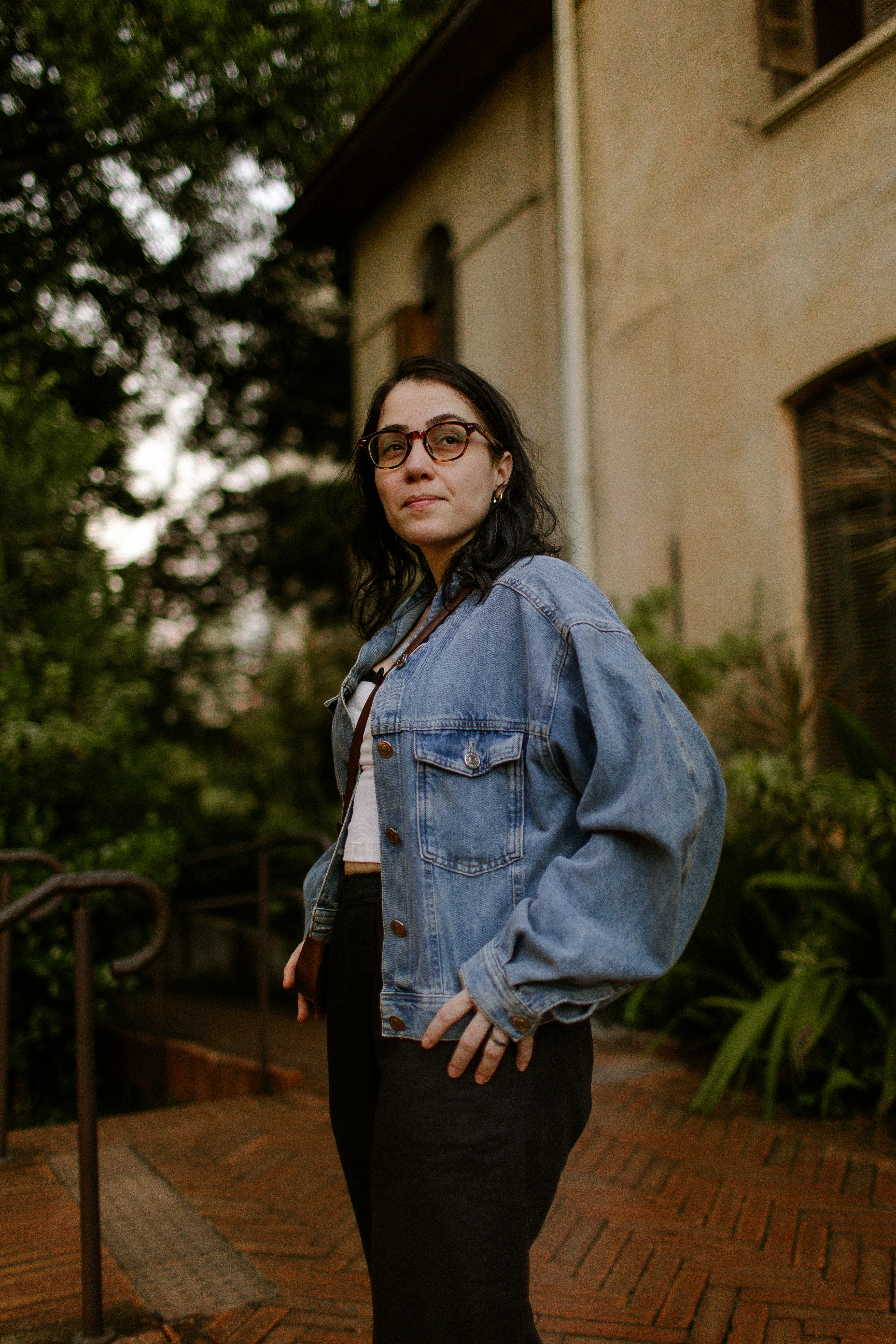 Portrait in Denims: A Quiet Confidence by the Old Building