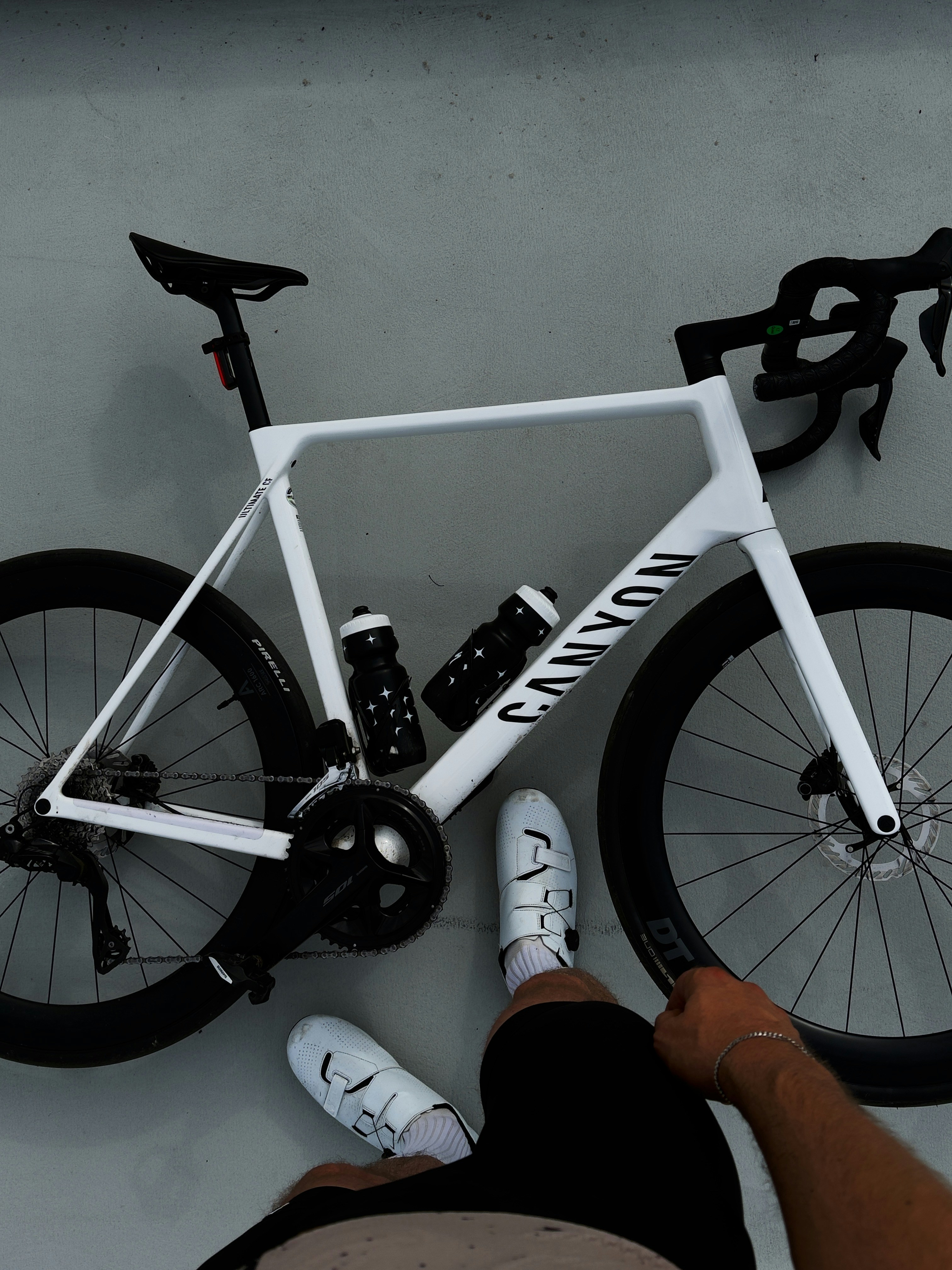 Pedal Precision: A White Canyon Bike Leaning Against a Wall
