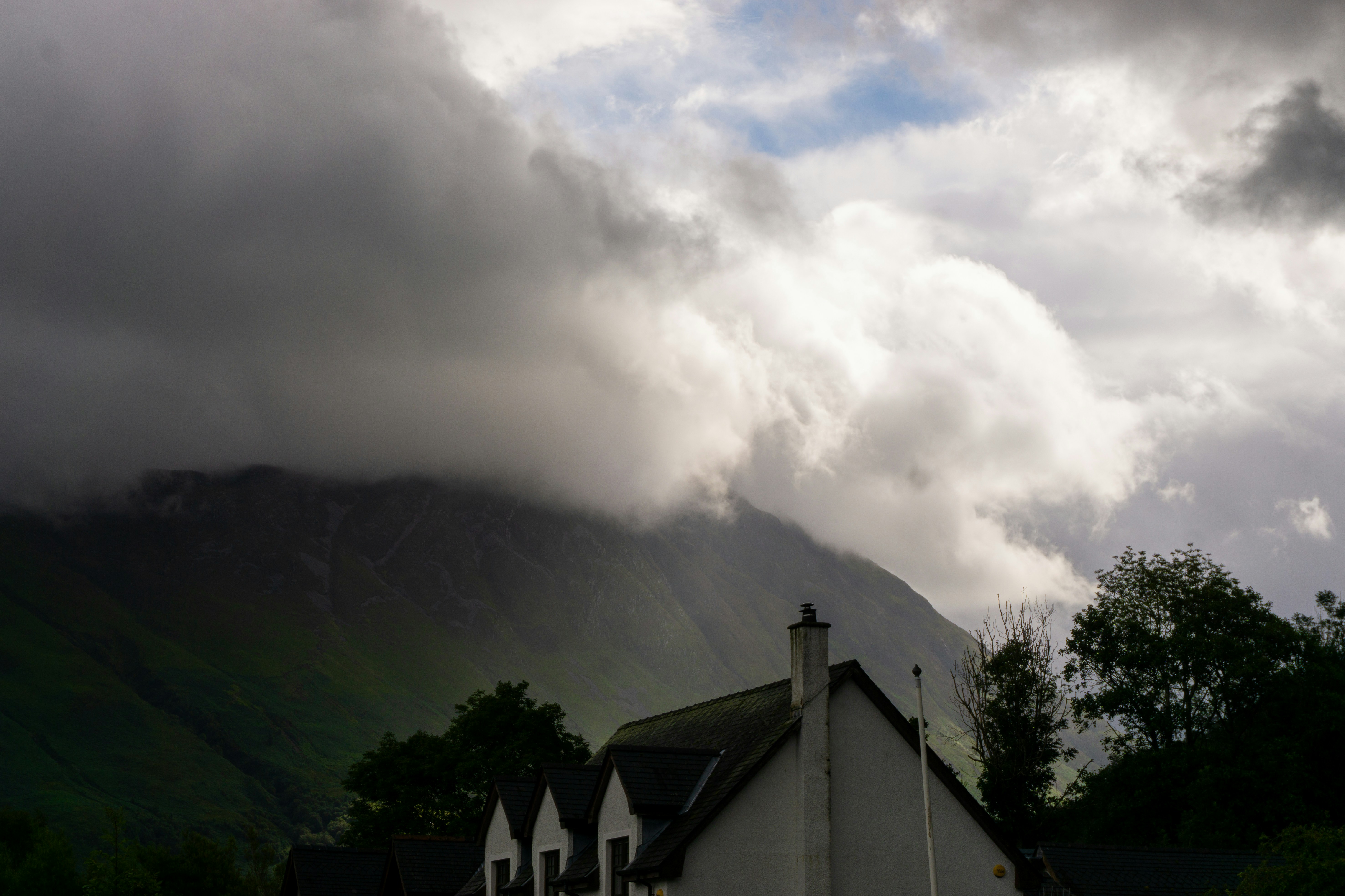 Storm-Swept Rooflines Beneath Looming Clouds