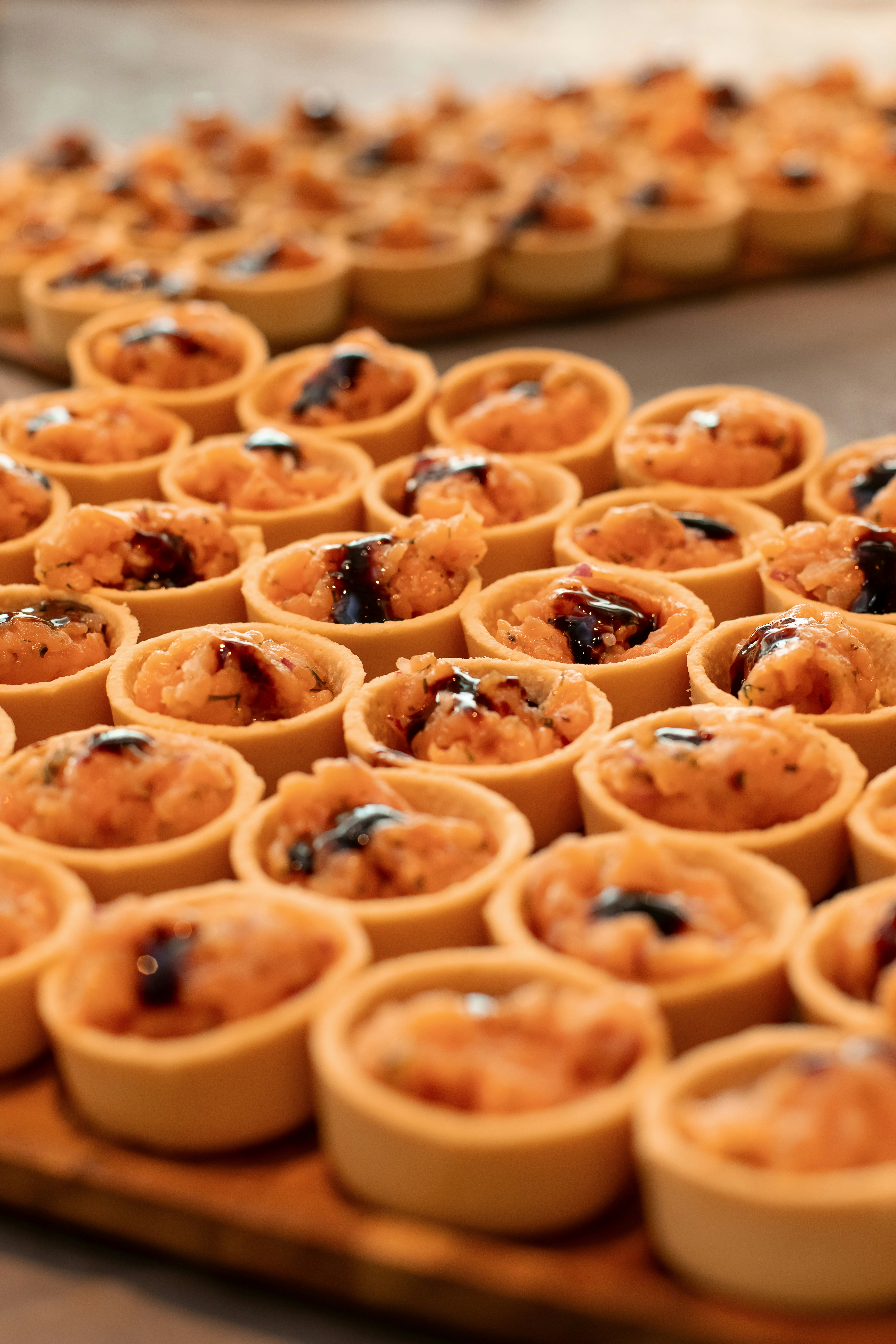 Golden Bite: Tiny Tarts Arranged in a Sweet Lineup