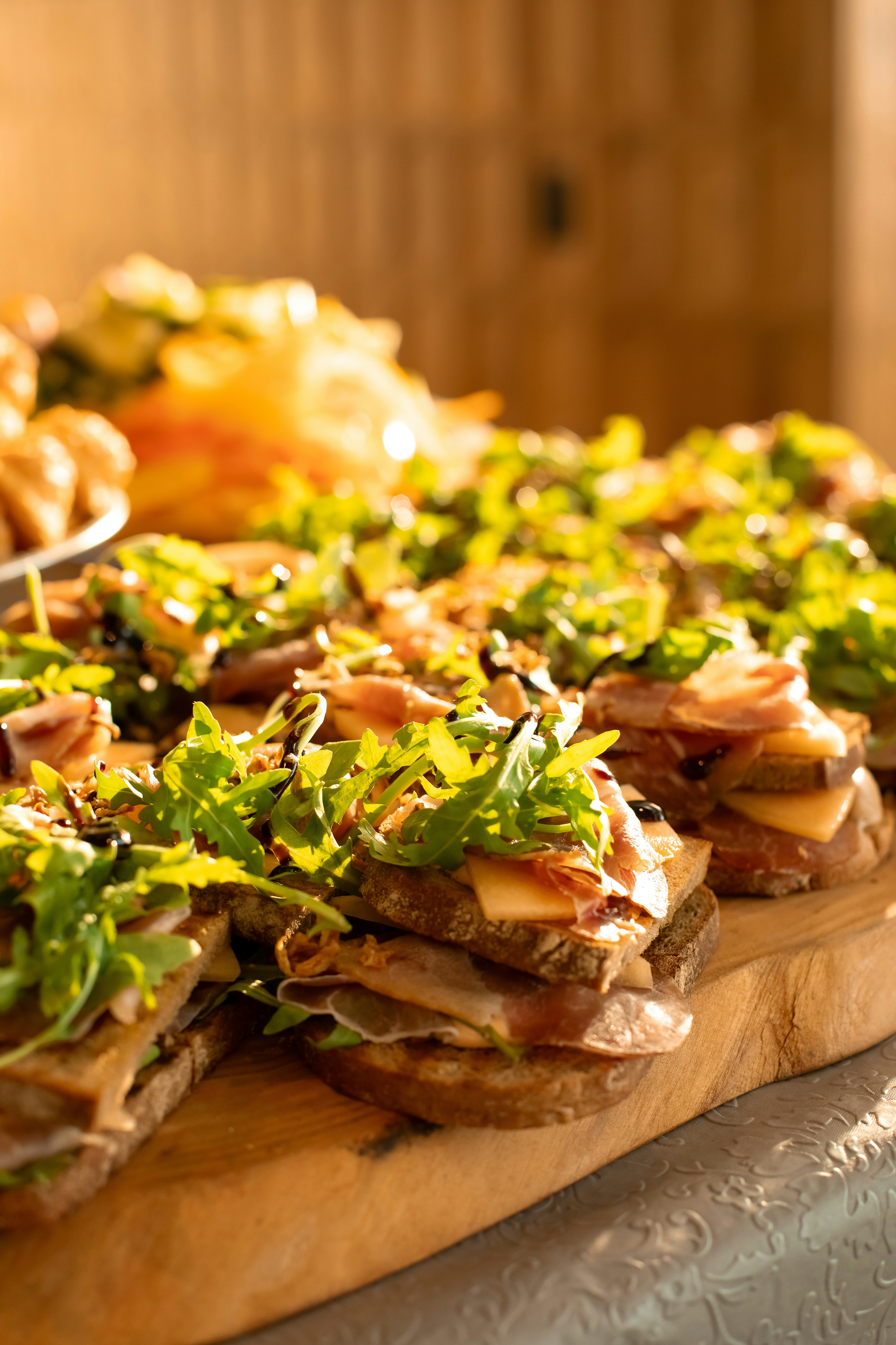 Arpeggio of Open-Faced Sandwiches on a Wooden Board