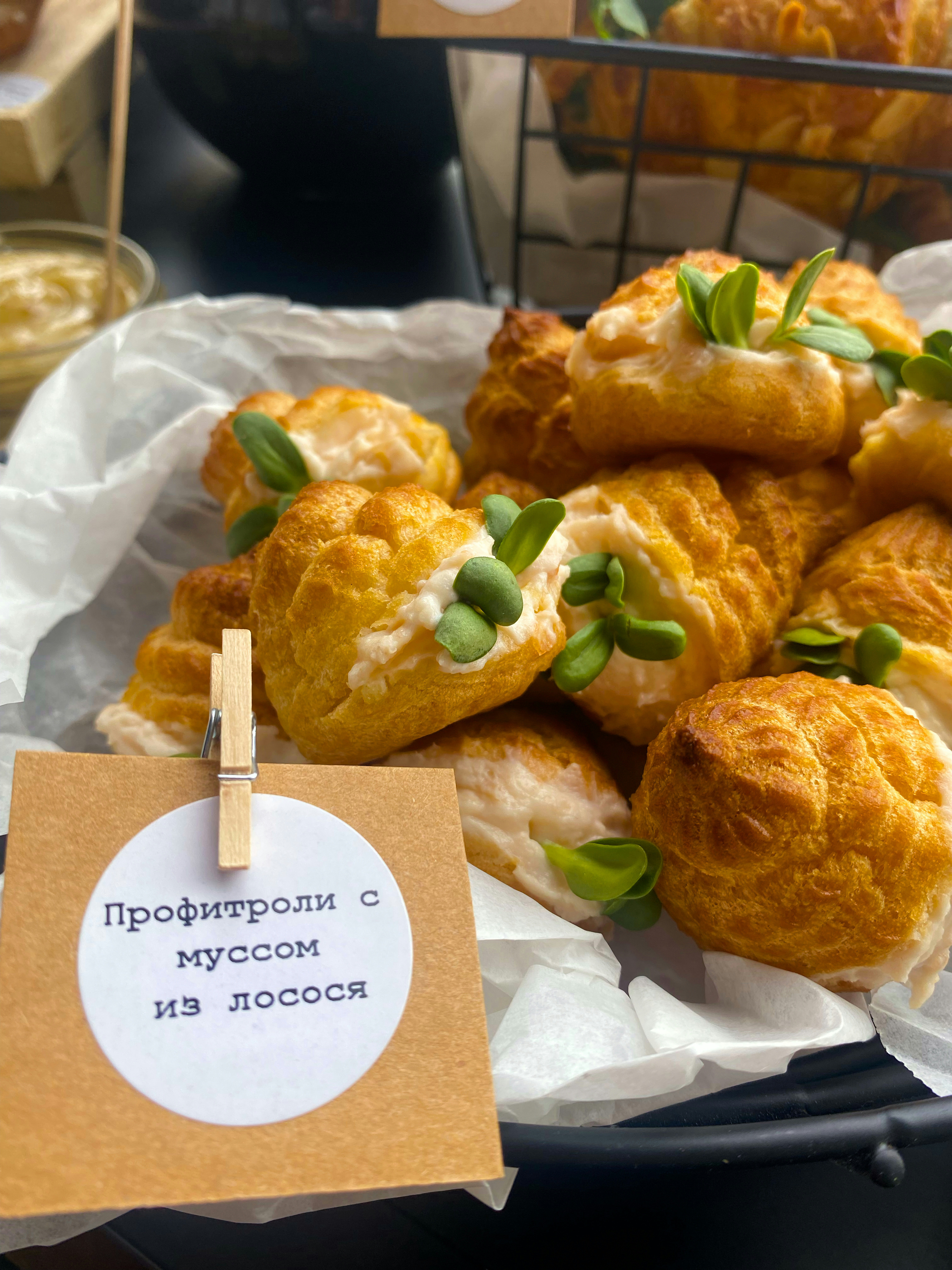Creamy Puffs on a Tray: Savory Pastries with a Salmon Pink Label