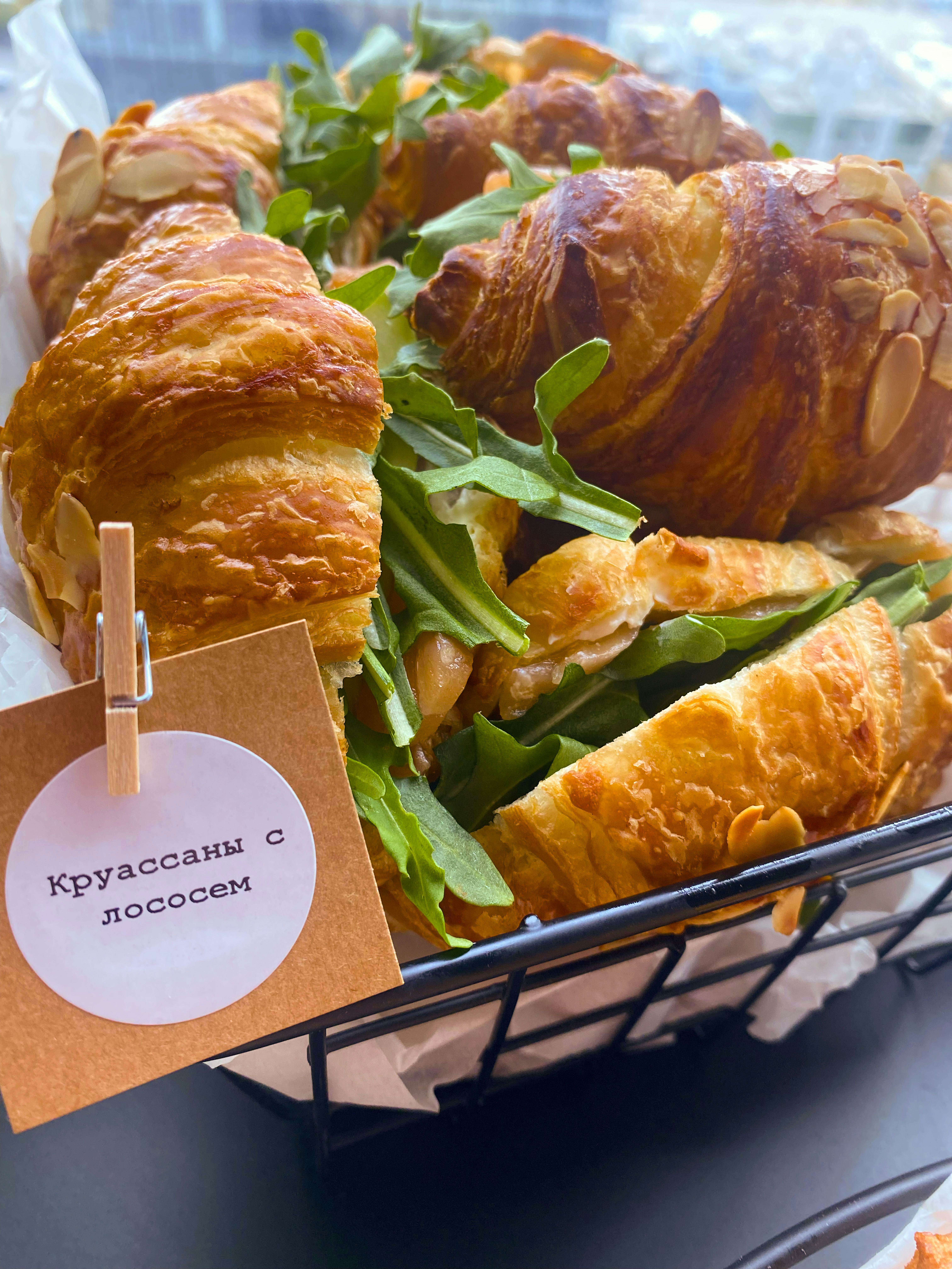 Golden Pastry Basket: Arugula-Crowned Croissants with a Labeled Snack Tag
