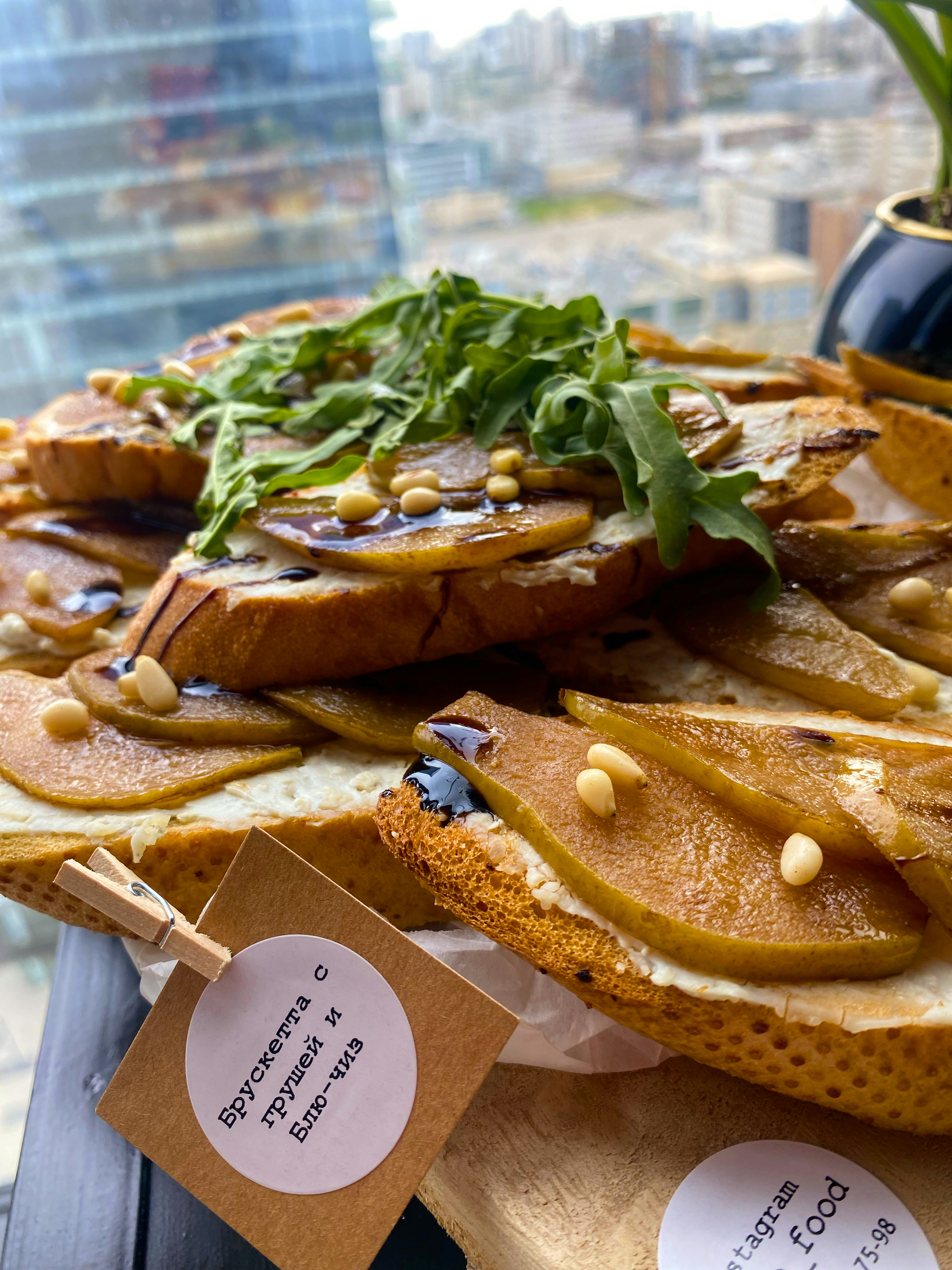 Crispy Pear and Mushroom Bruschetta Tower Over a Cityscape
