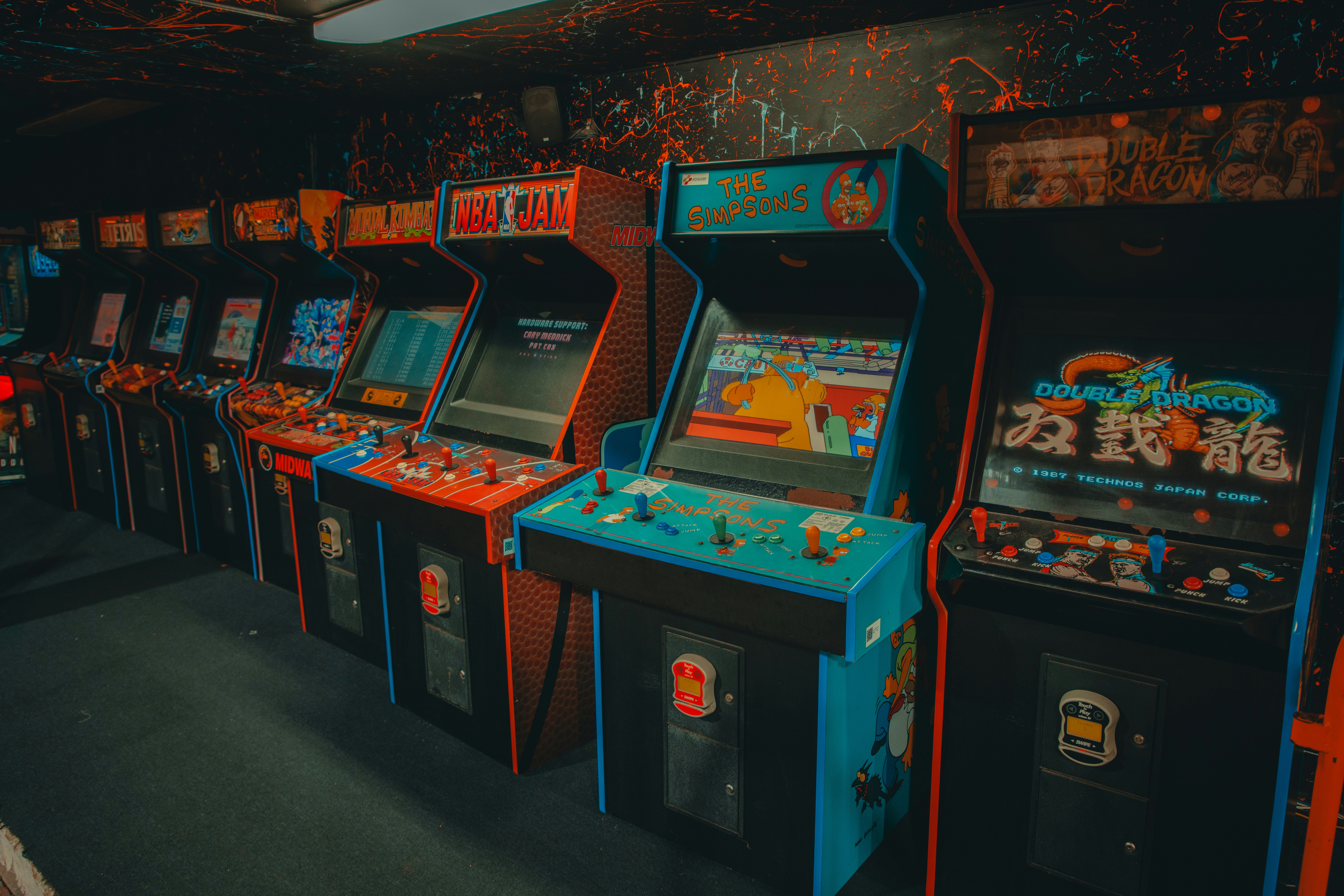 Arcade Row at Dusk: Neon Cabinets Line a Quiet Room