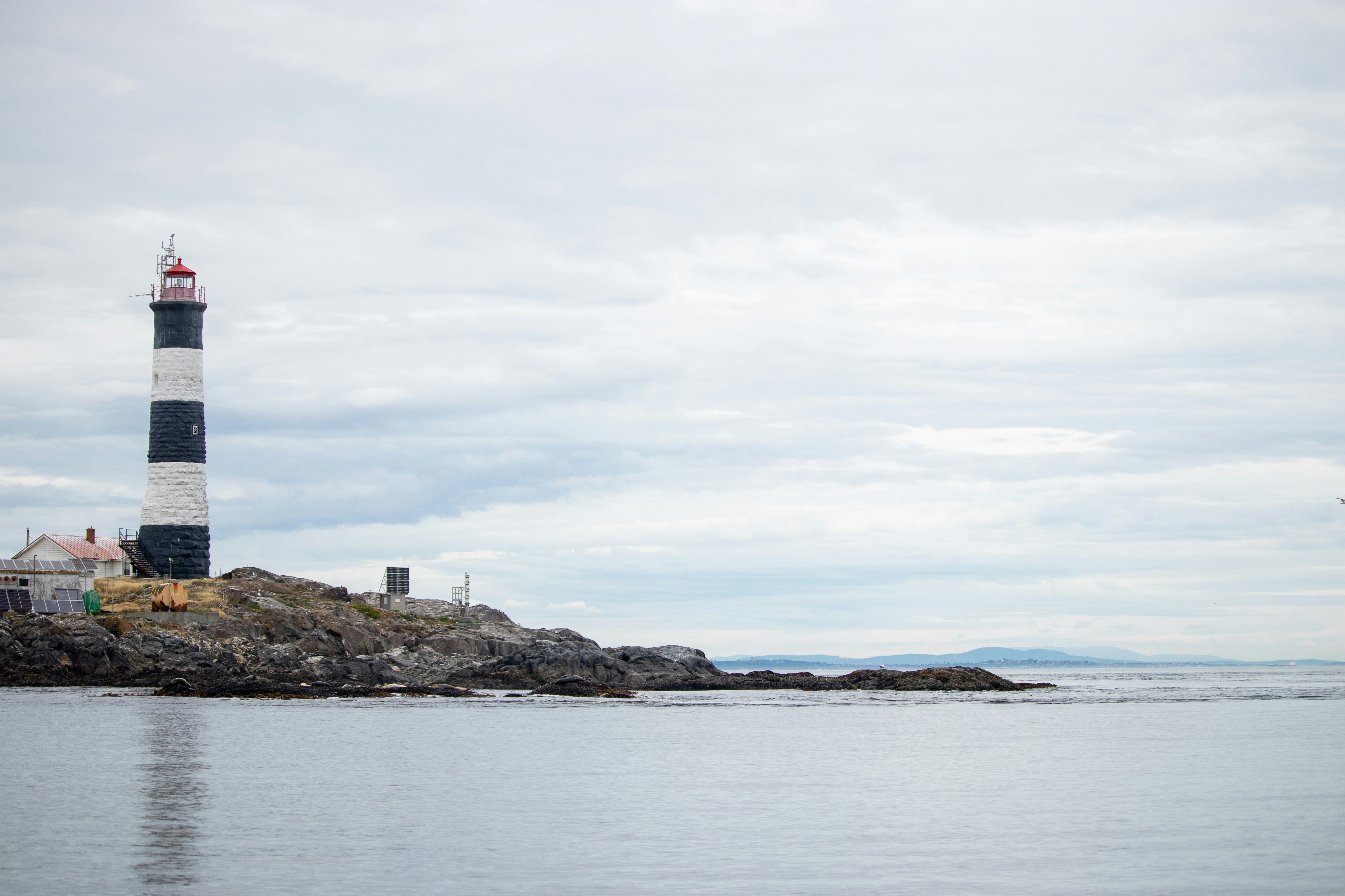 Coastal Beacon: A Lighthouseline Standing Against Quiet Seas