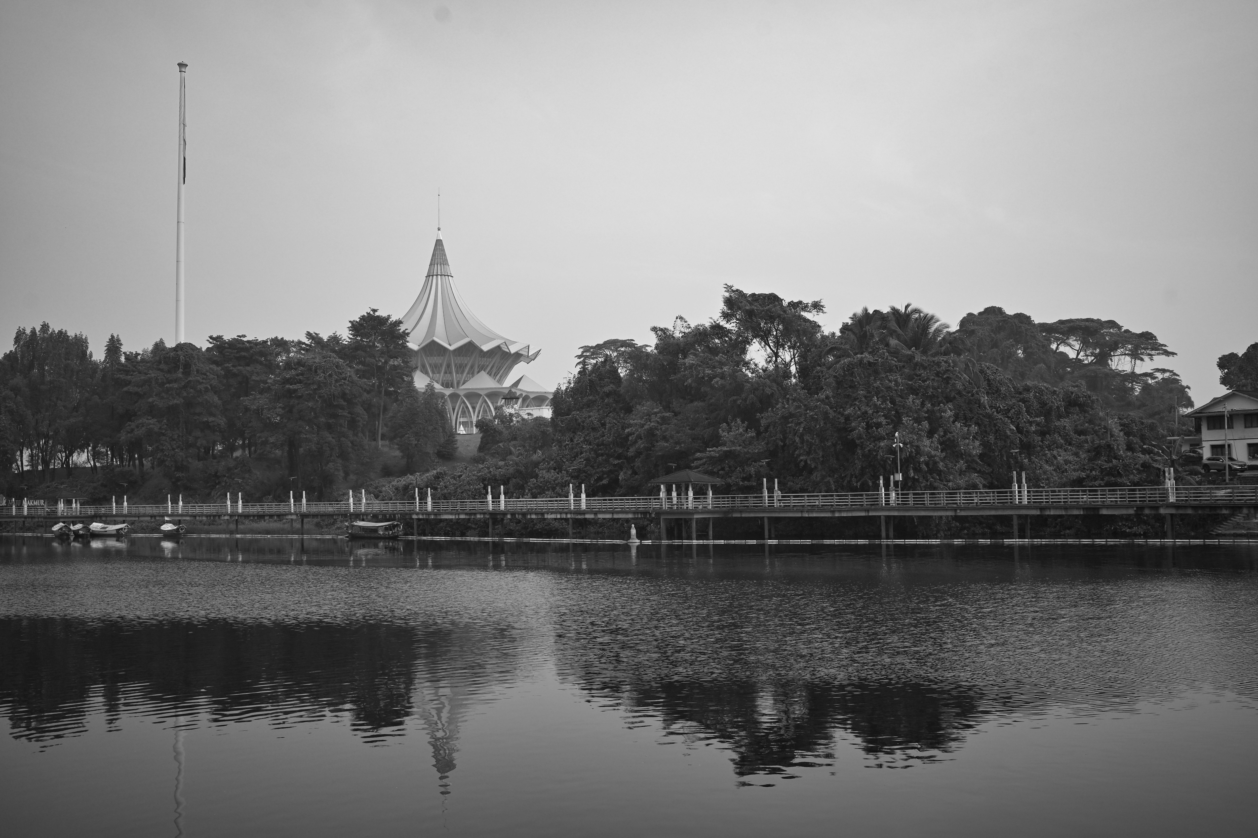 Silhouetted Pavilion and Waterfront Reflections