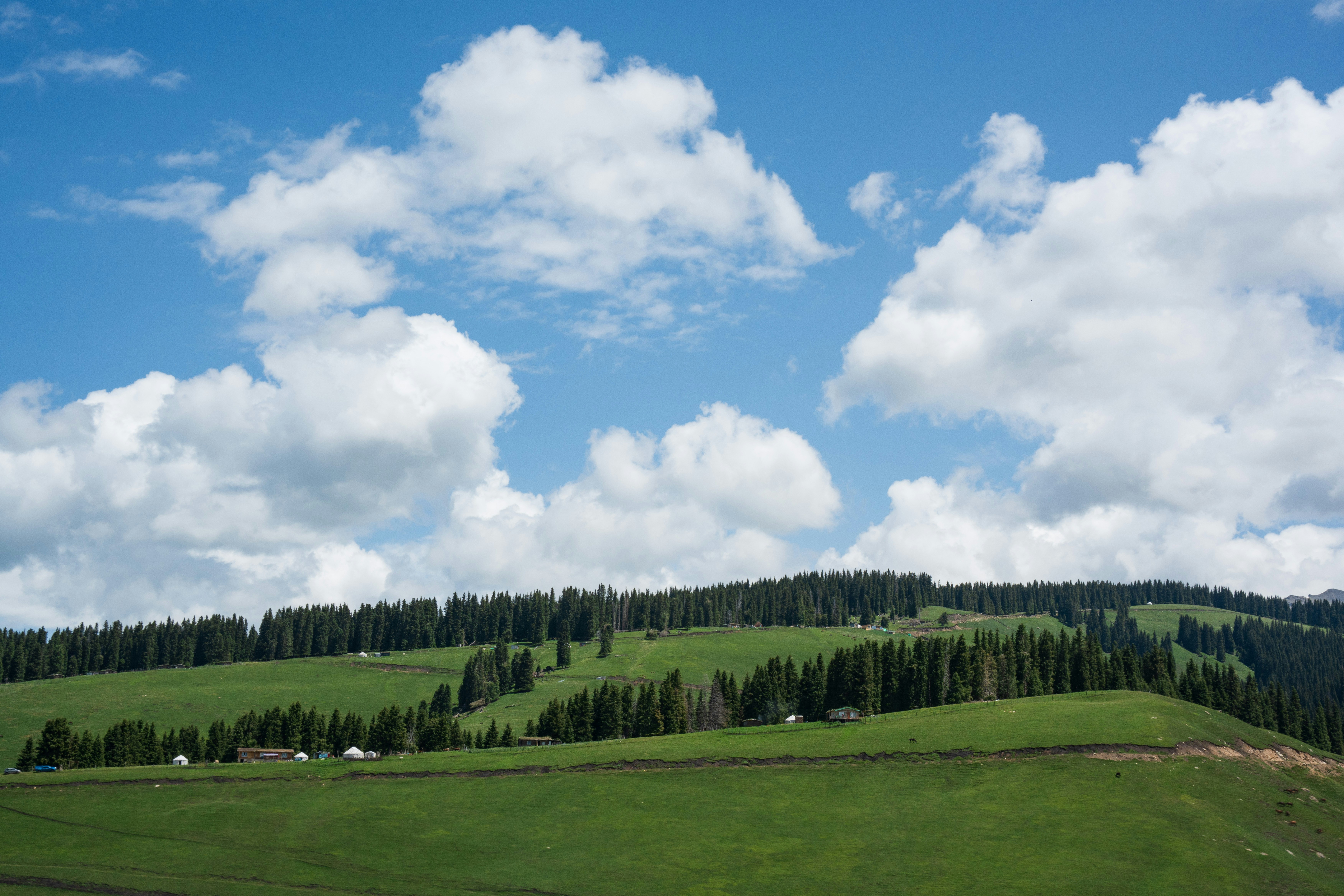 Rolling Hills Under a Patchwork Sky
