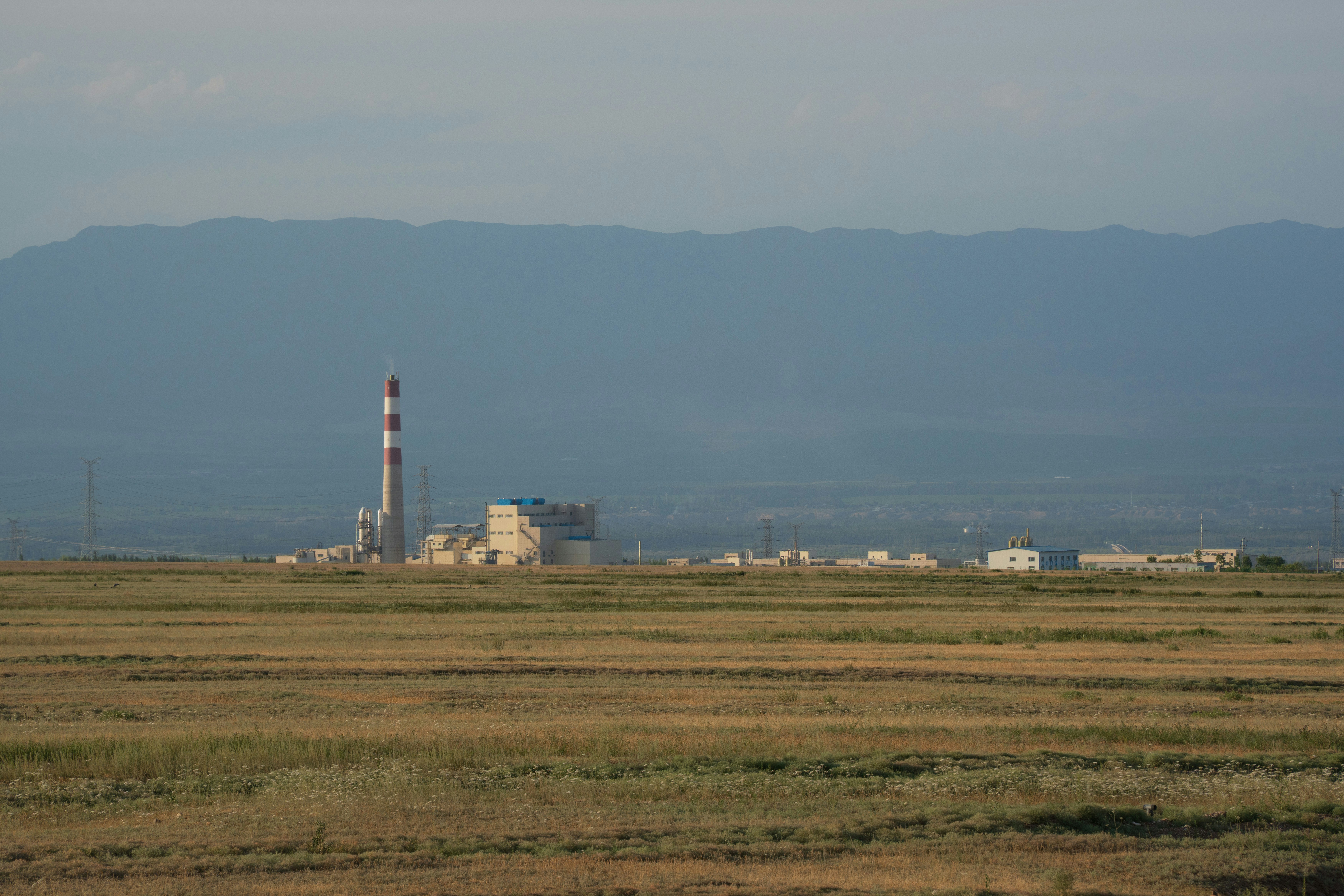 Lighthouse at the Plain: A distant beacon on an expansive landscape