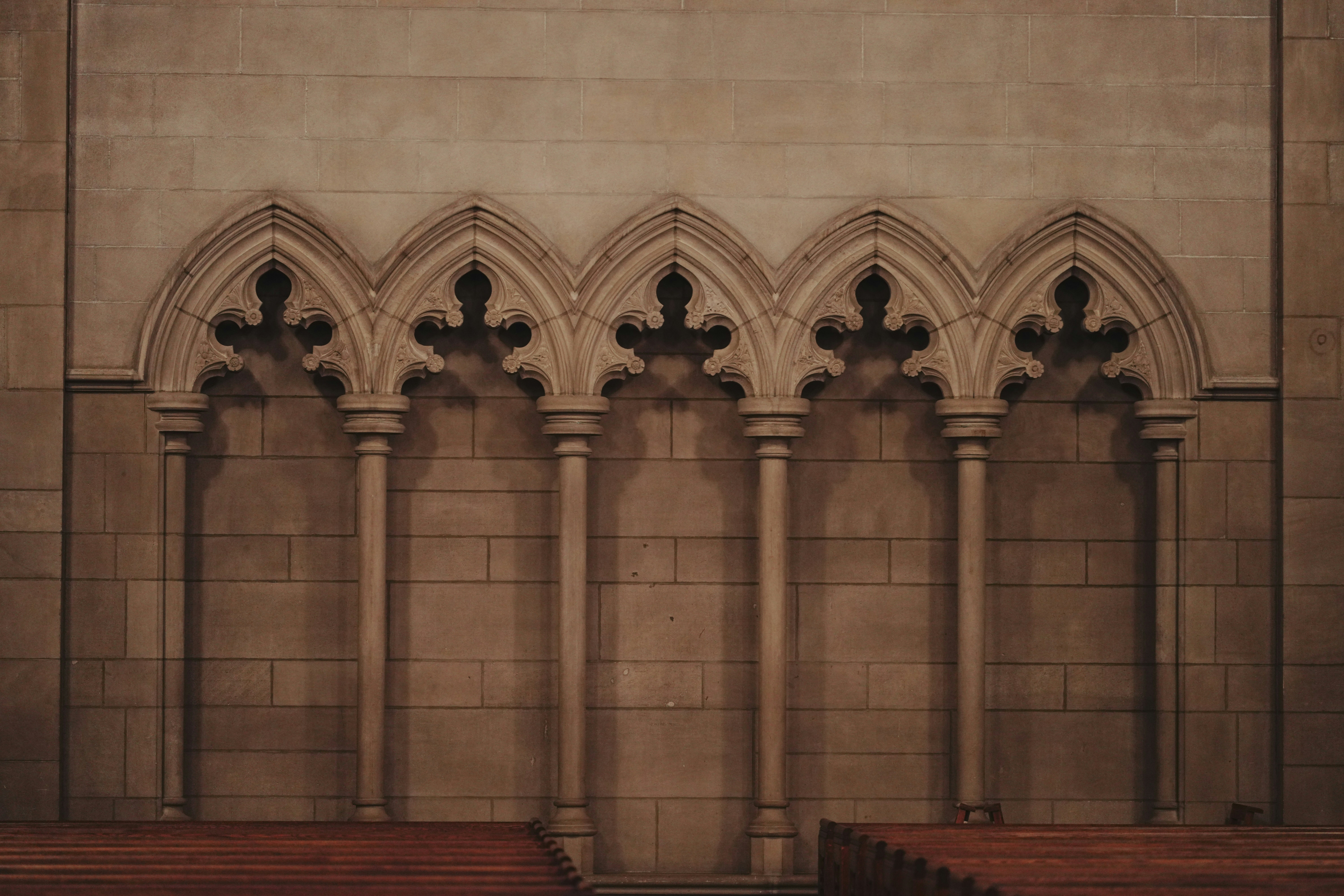 Arched Carved Arcades: A Quiet Wall of Stone