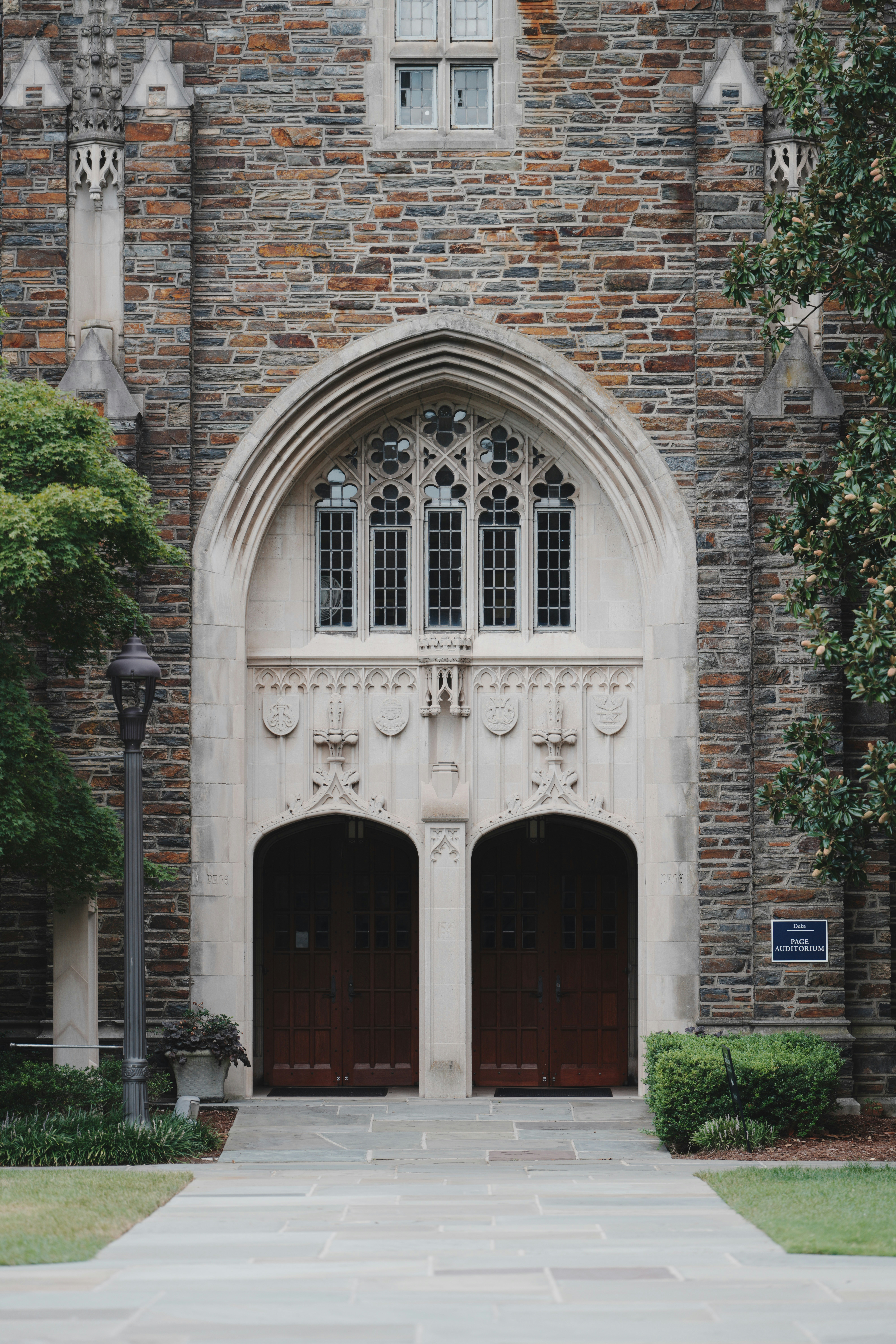 Gateway of Stone: A Gothic Archway Framed by Greenery