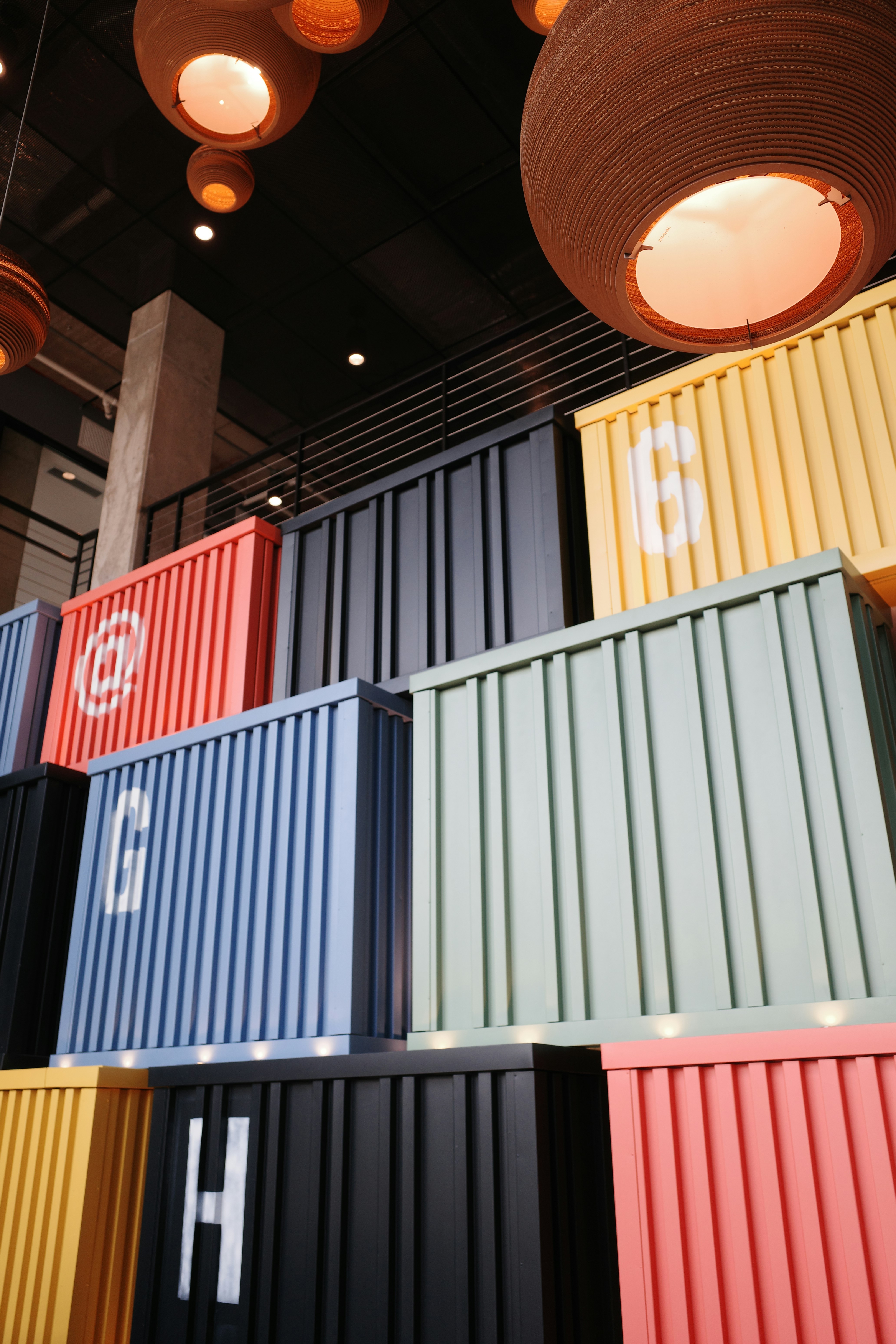 Stacked Color Blocks Under Warm Orb Lanterns