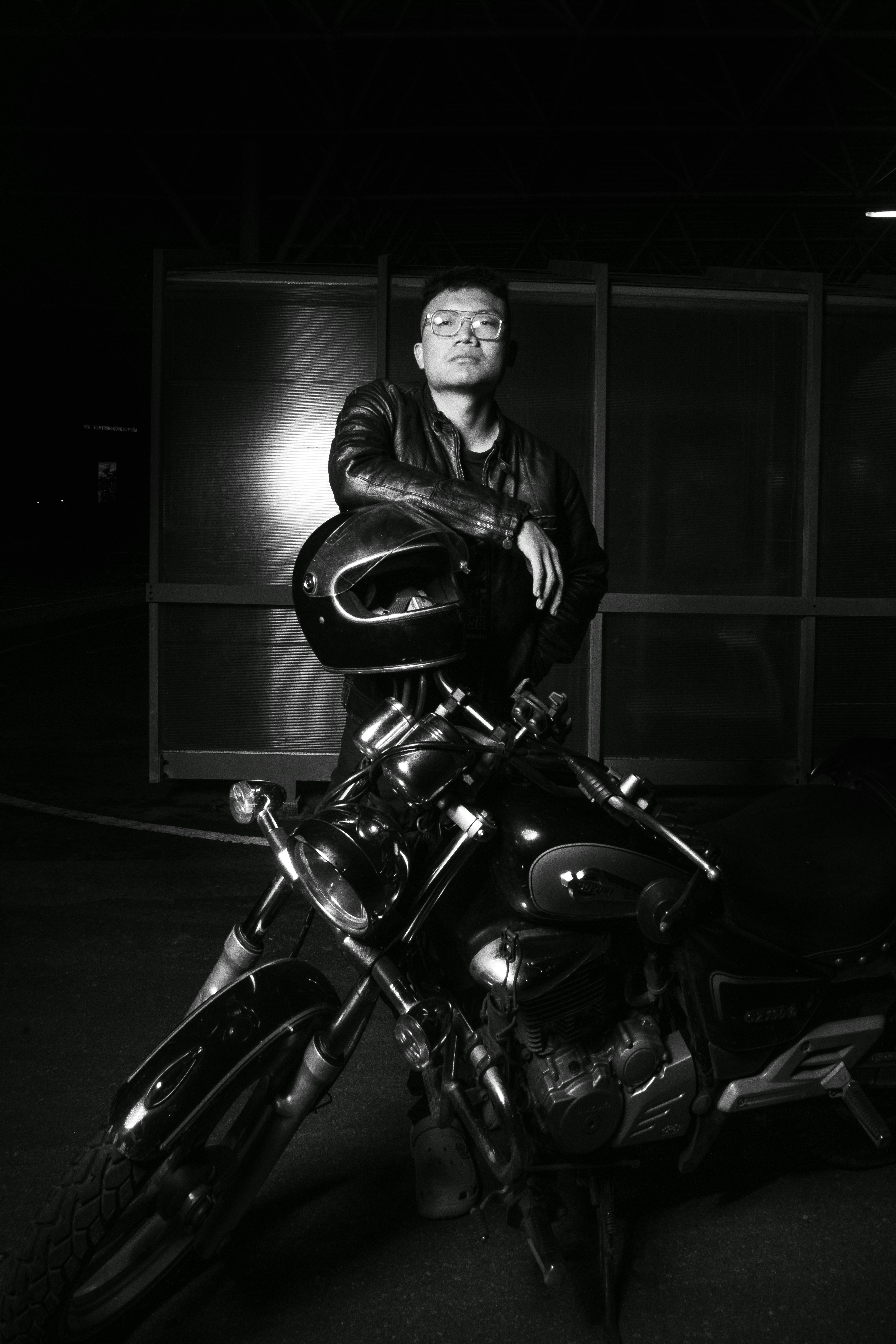 Rider in Shadow: A Quiet Moment by the Night Bike