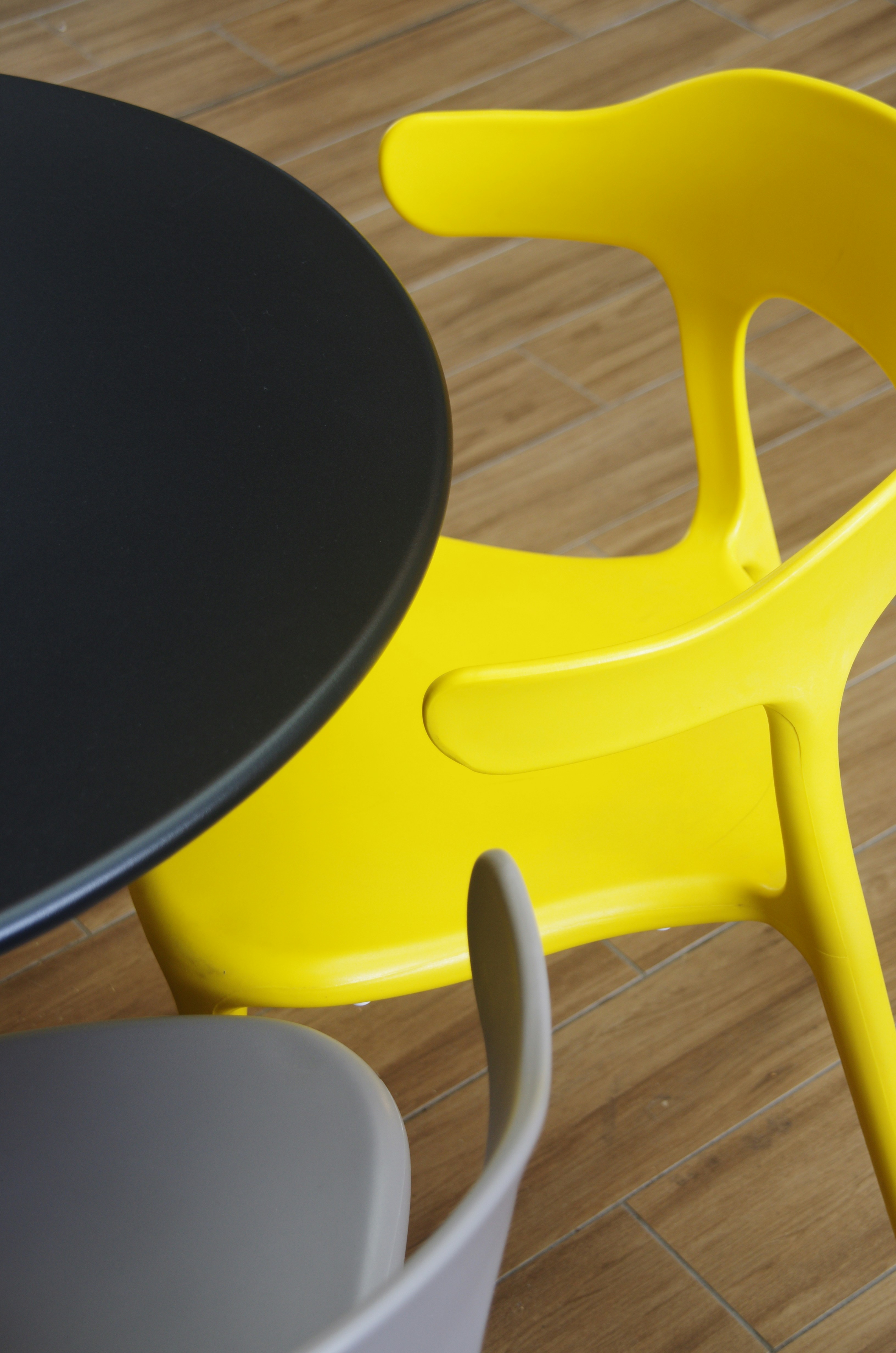 Bright Yellow Chair Beckons Atop a Modern Table Scene