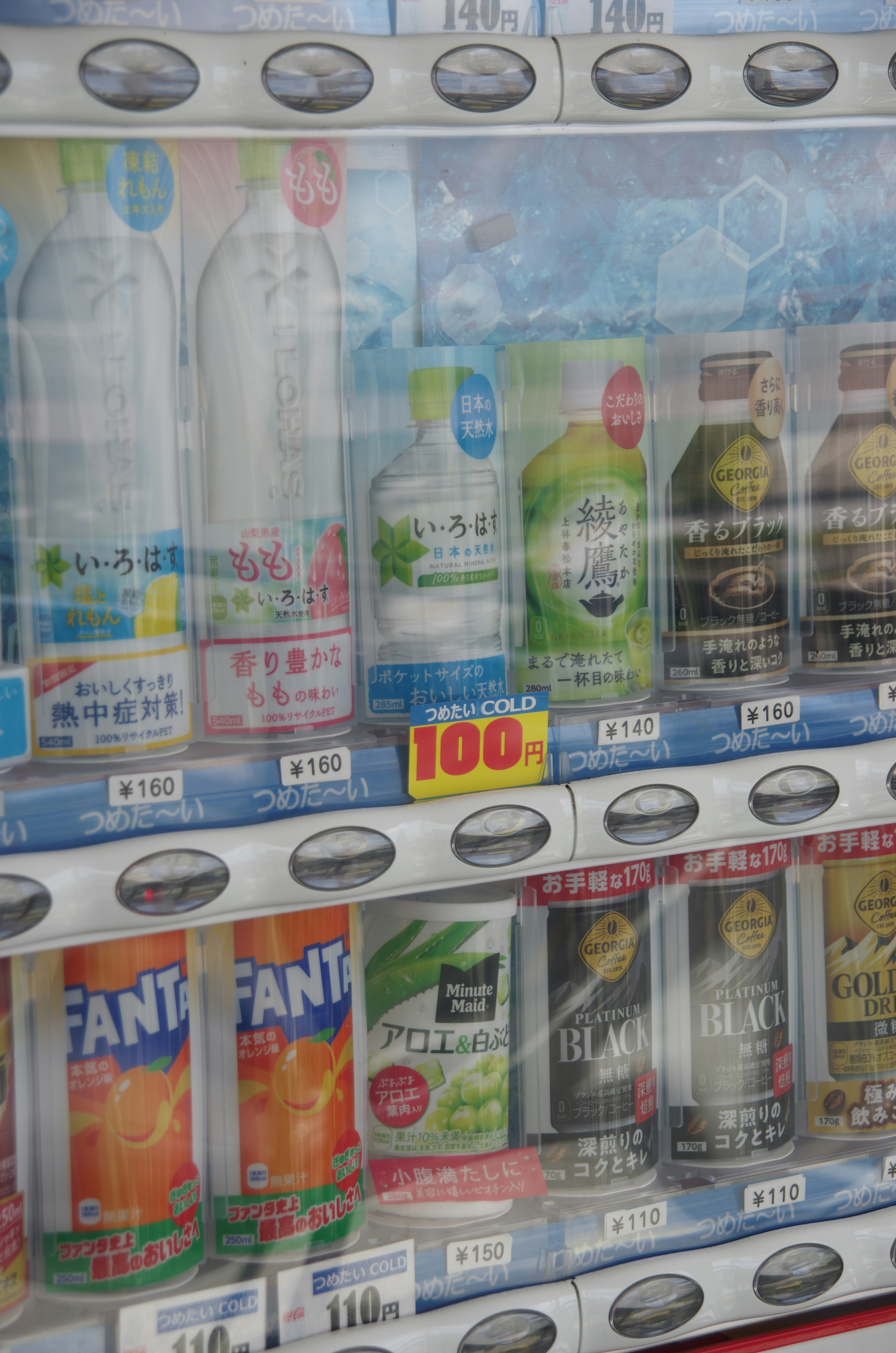 Vending Shelf Portrait: Colorful Bottles and Neon Labels Behind Glass