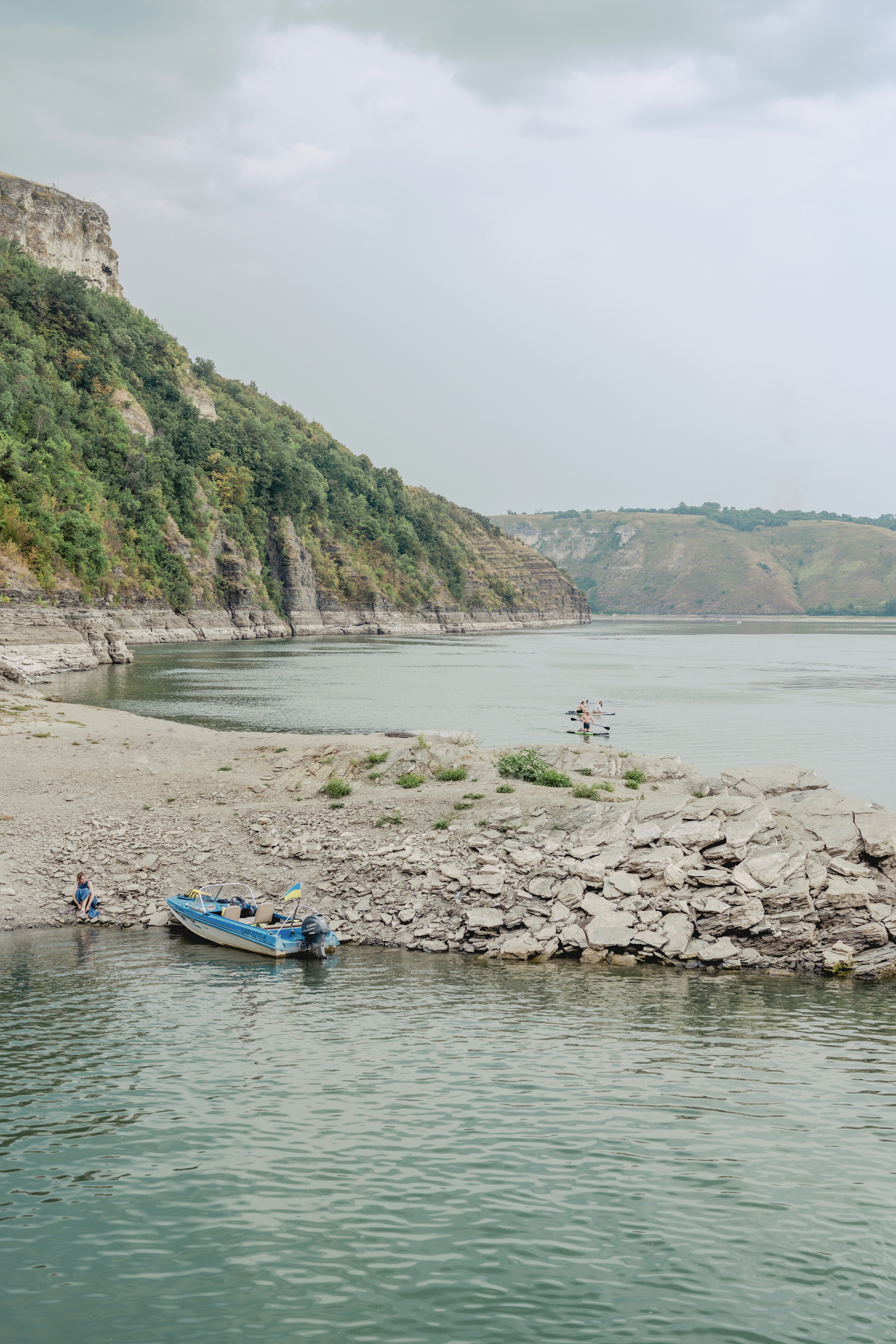Coastal Outcrop and Quiet Boat at the Tidal Bend