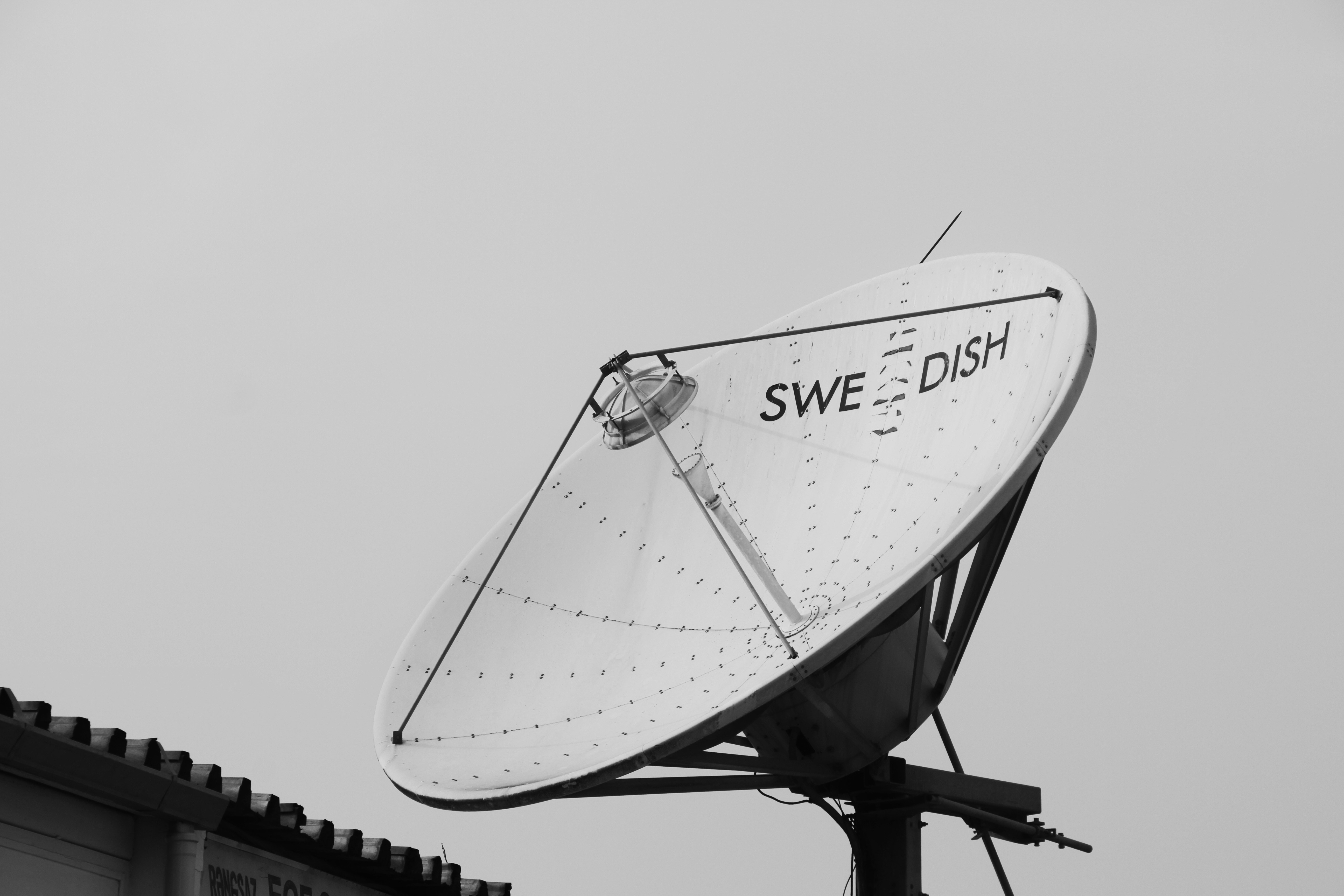 Dish Aligns with the Sky: A Black-and-White Satellite Moment