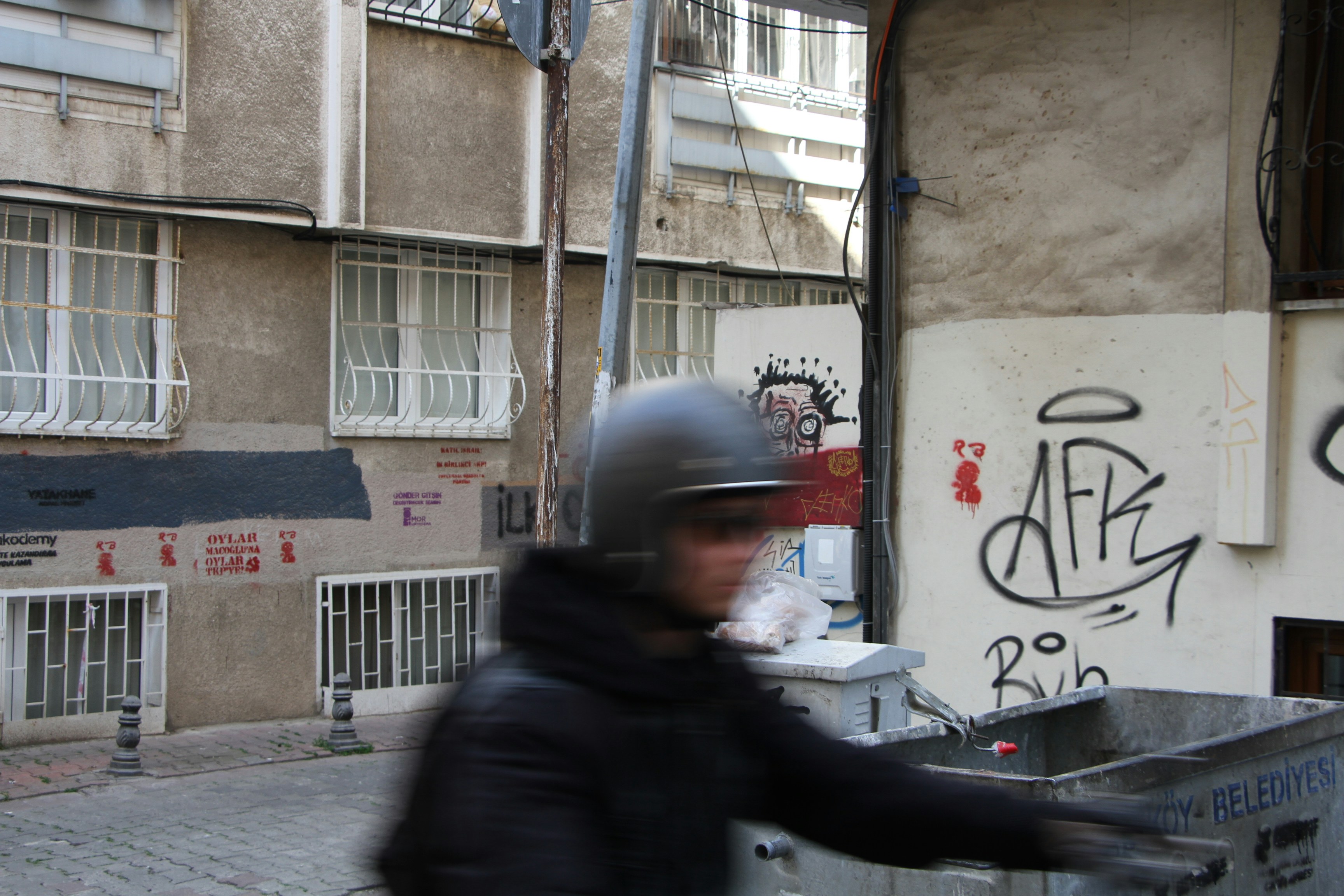 Blurred Cyclist in an Urban Alleyway