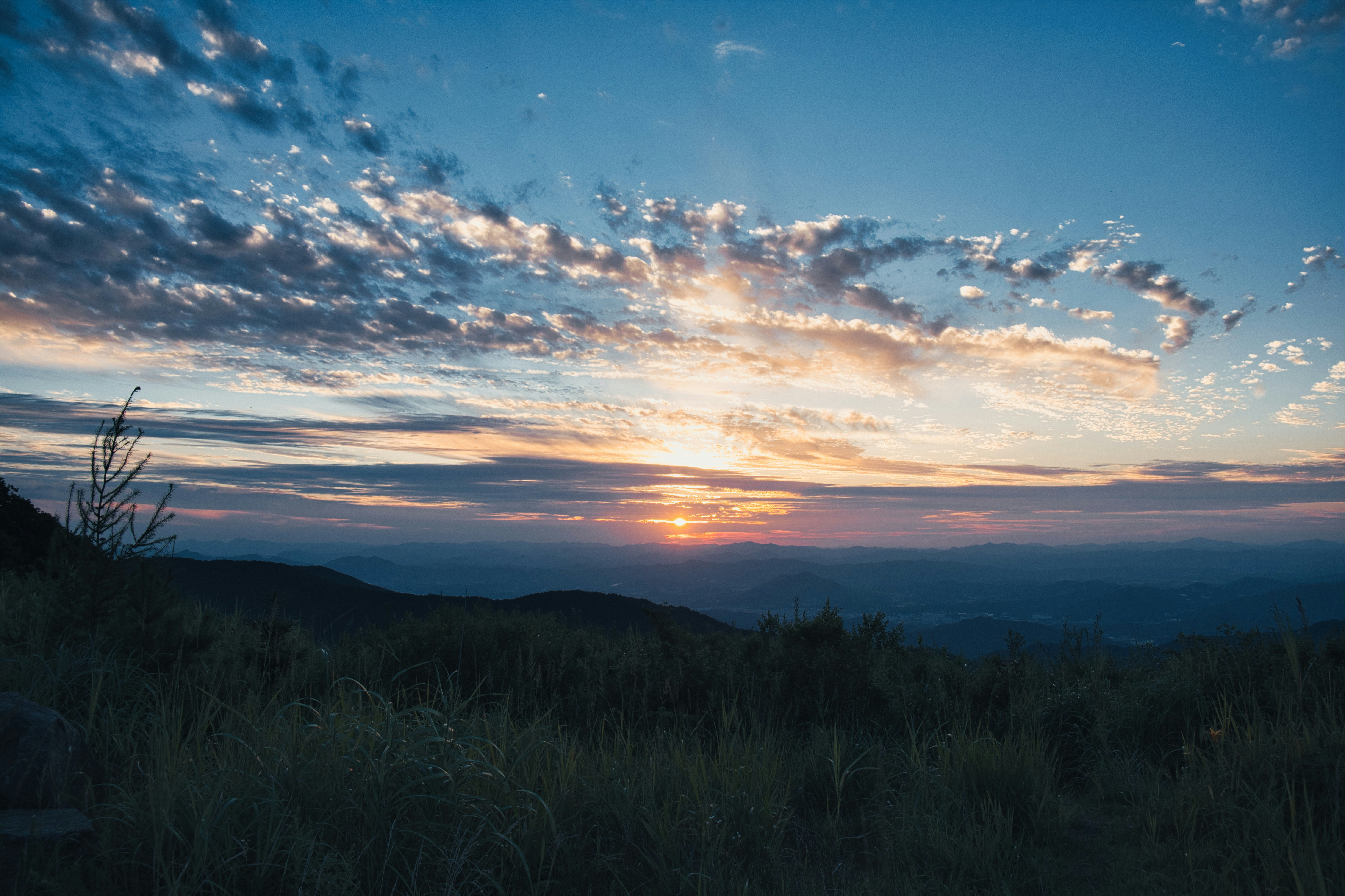 Sunset Over Rolling Hills: A Quiet Horizon at Dusk