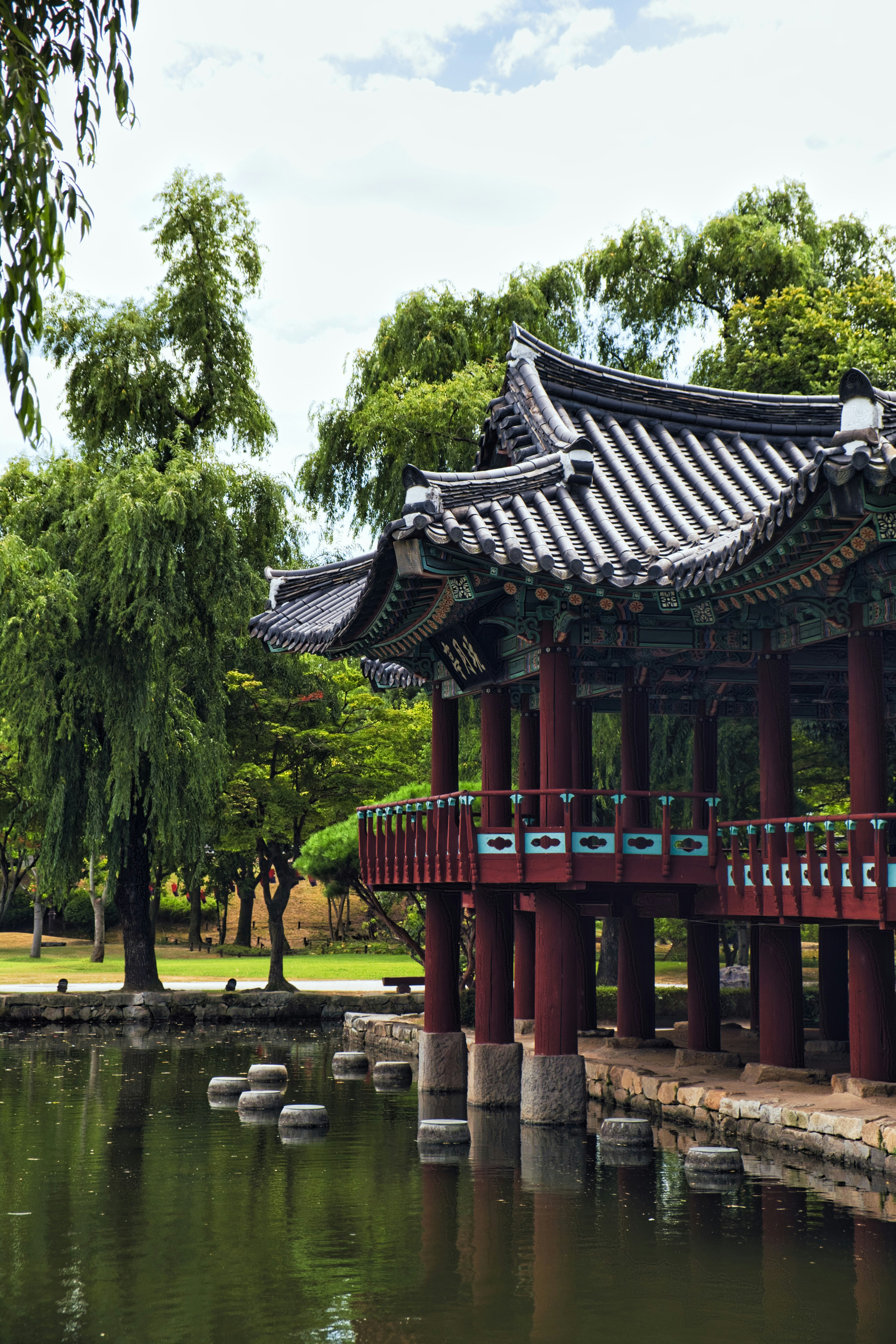Heritage on stilts: lacquered pavilion over tranquil pond