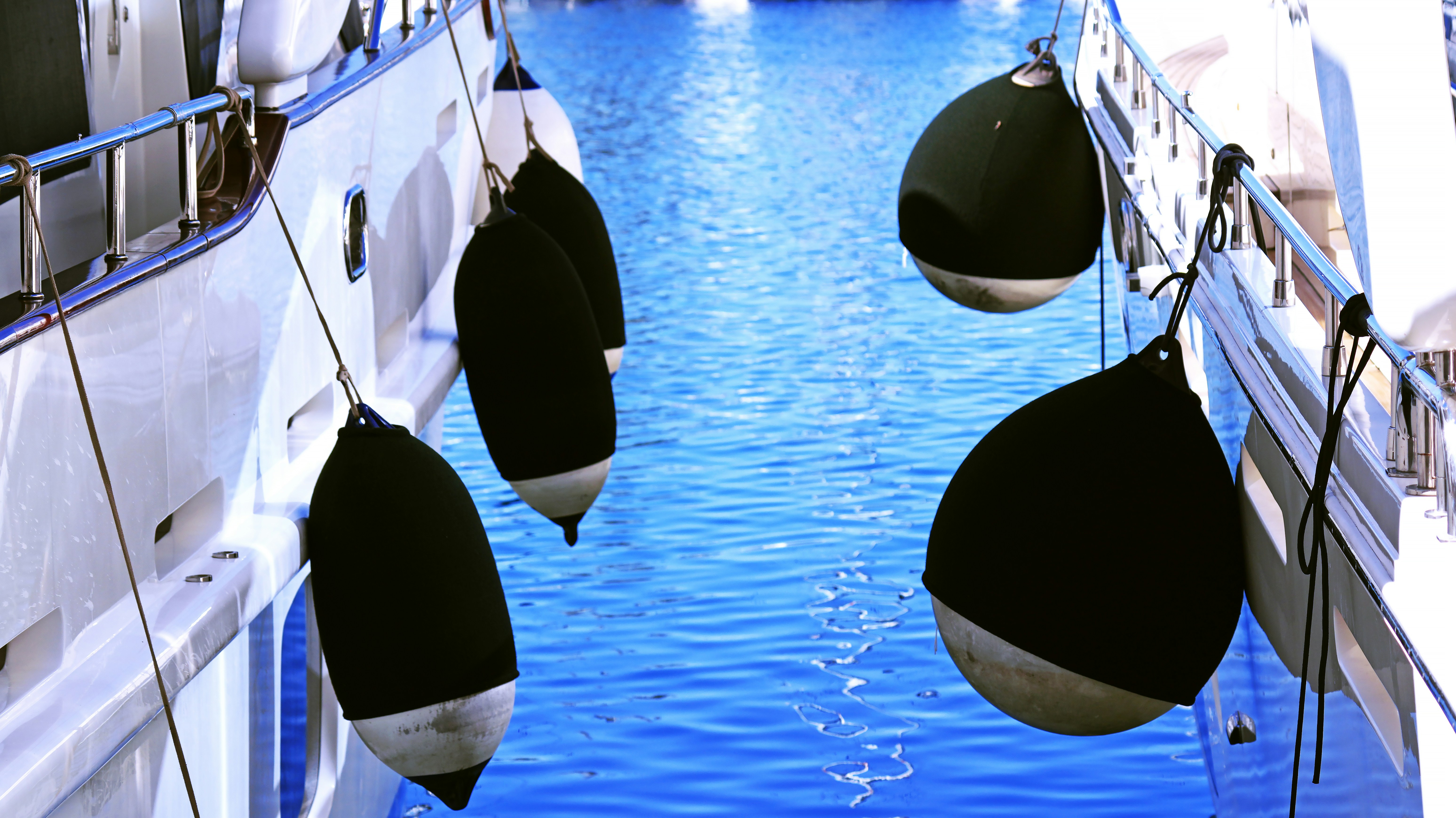 Between the Buoys: Blue Reflections and Mooring in Still Water