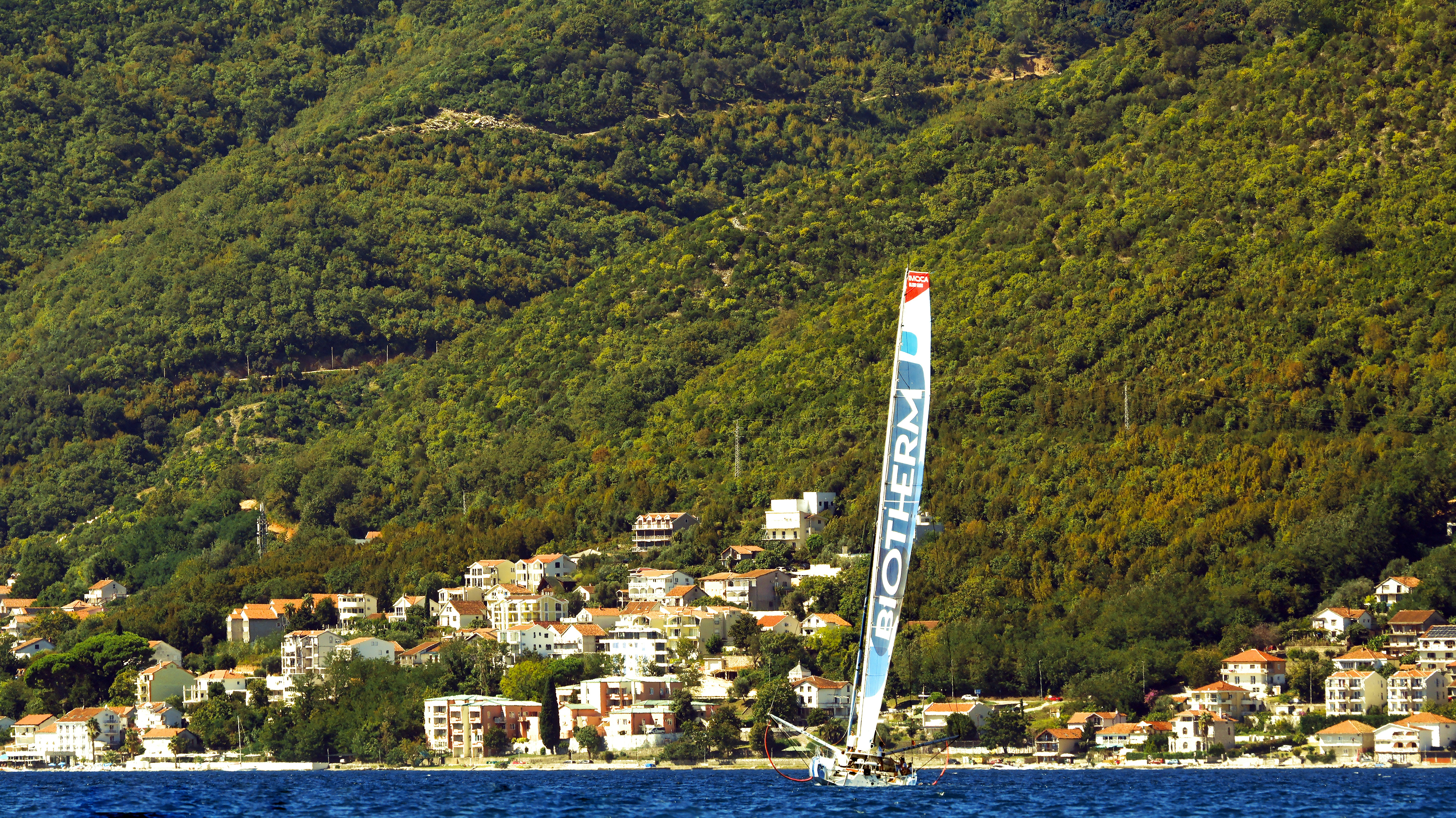 Sailing Banner Over a Quiet Coastal Town