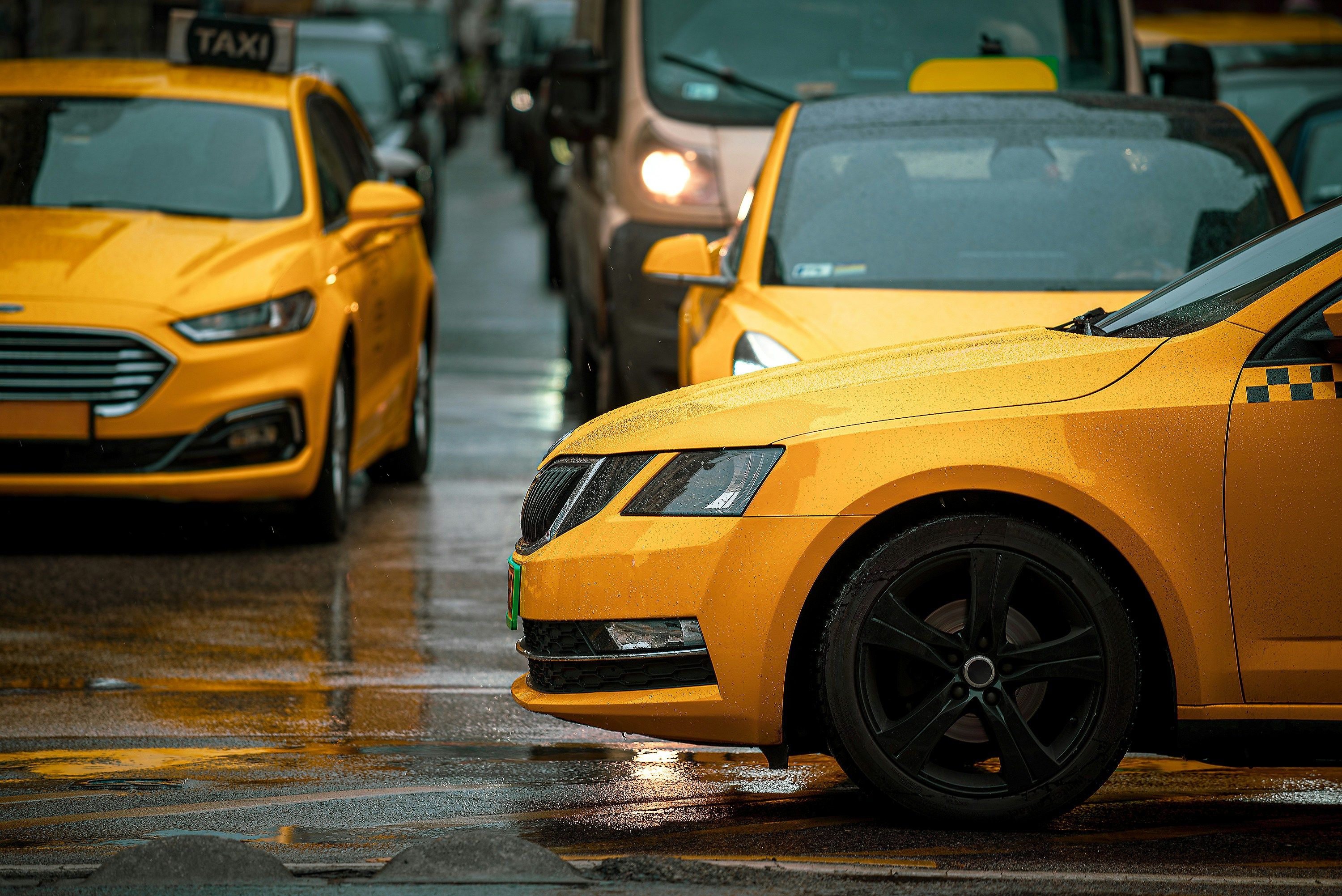Frontier of Yellow: Taxis in the Rain-Slick Street