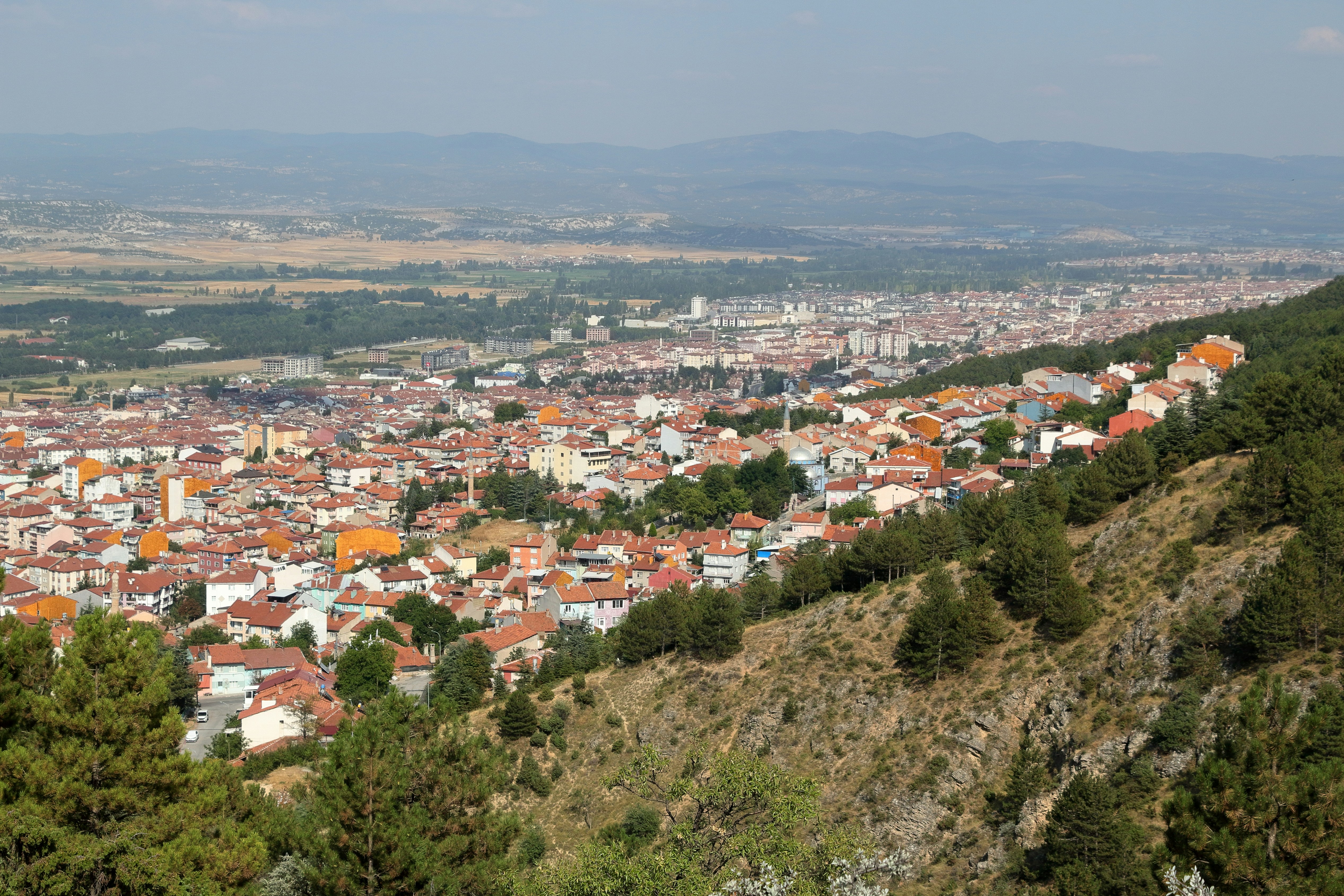 Sunlit hillside town tucked along a winding slope