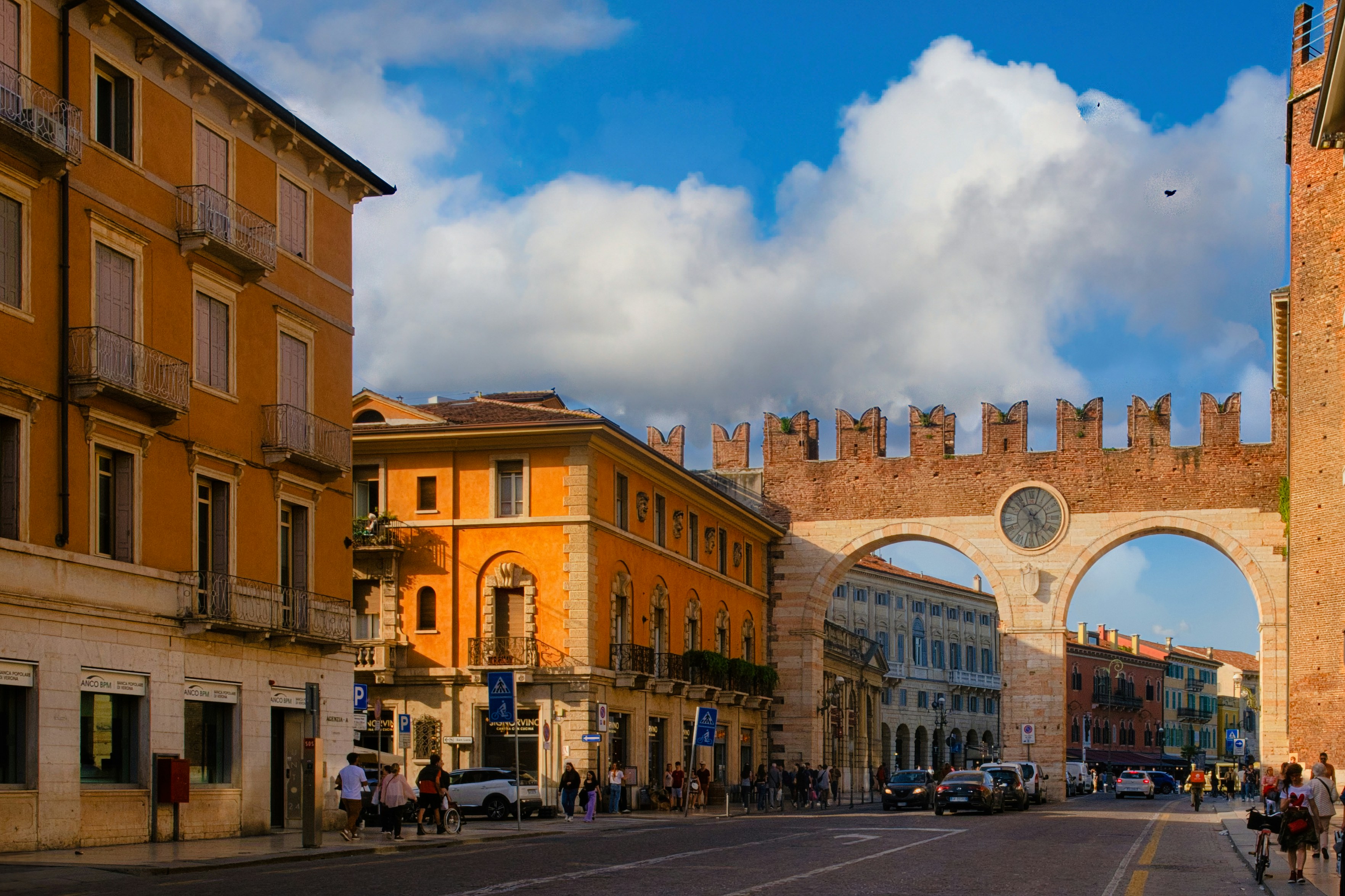 Arched Gateway Overlooking a Lively Piazza