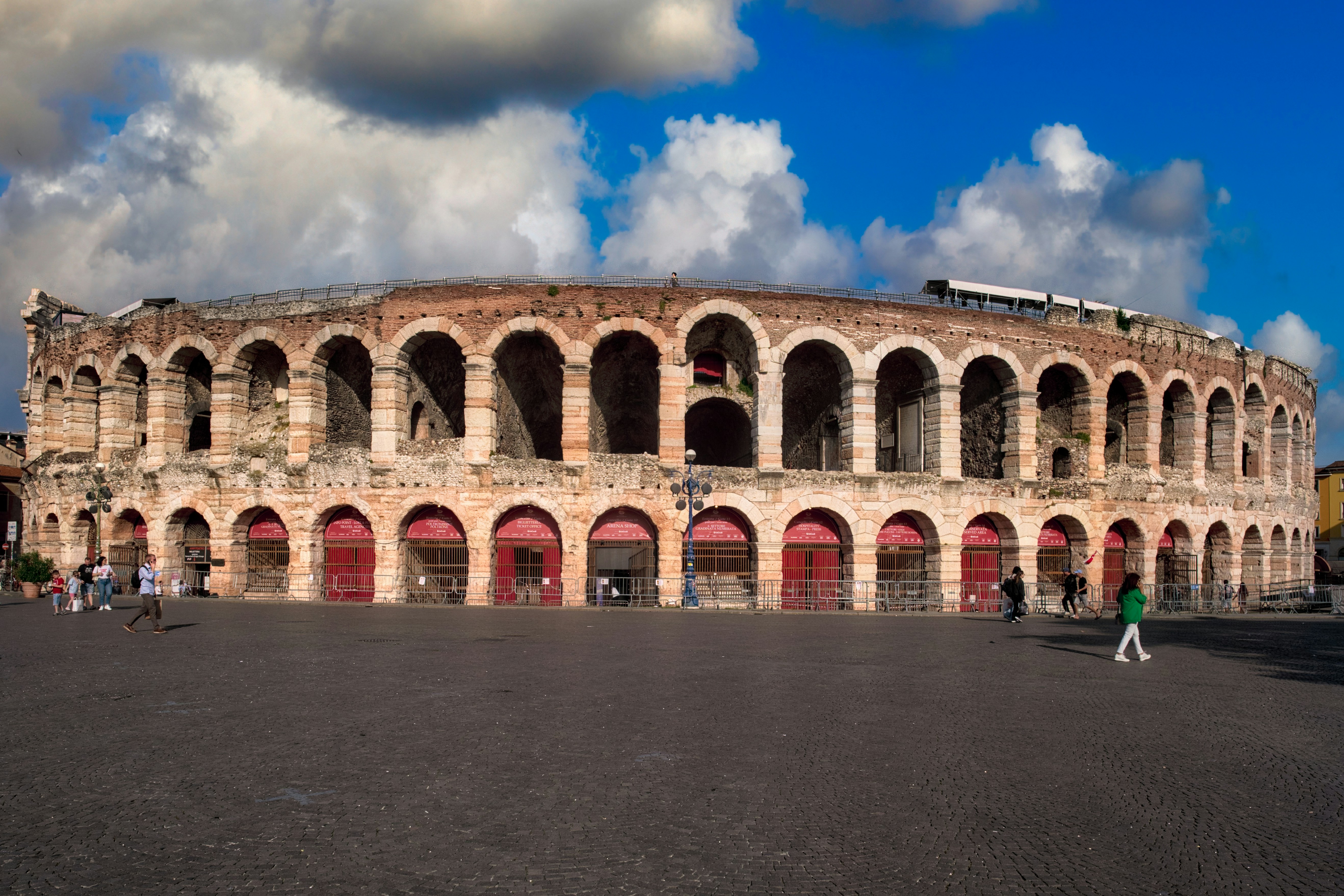 The Arch of Echoes: A Roman Amphitheater under Cobalt Sky
