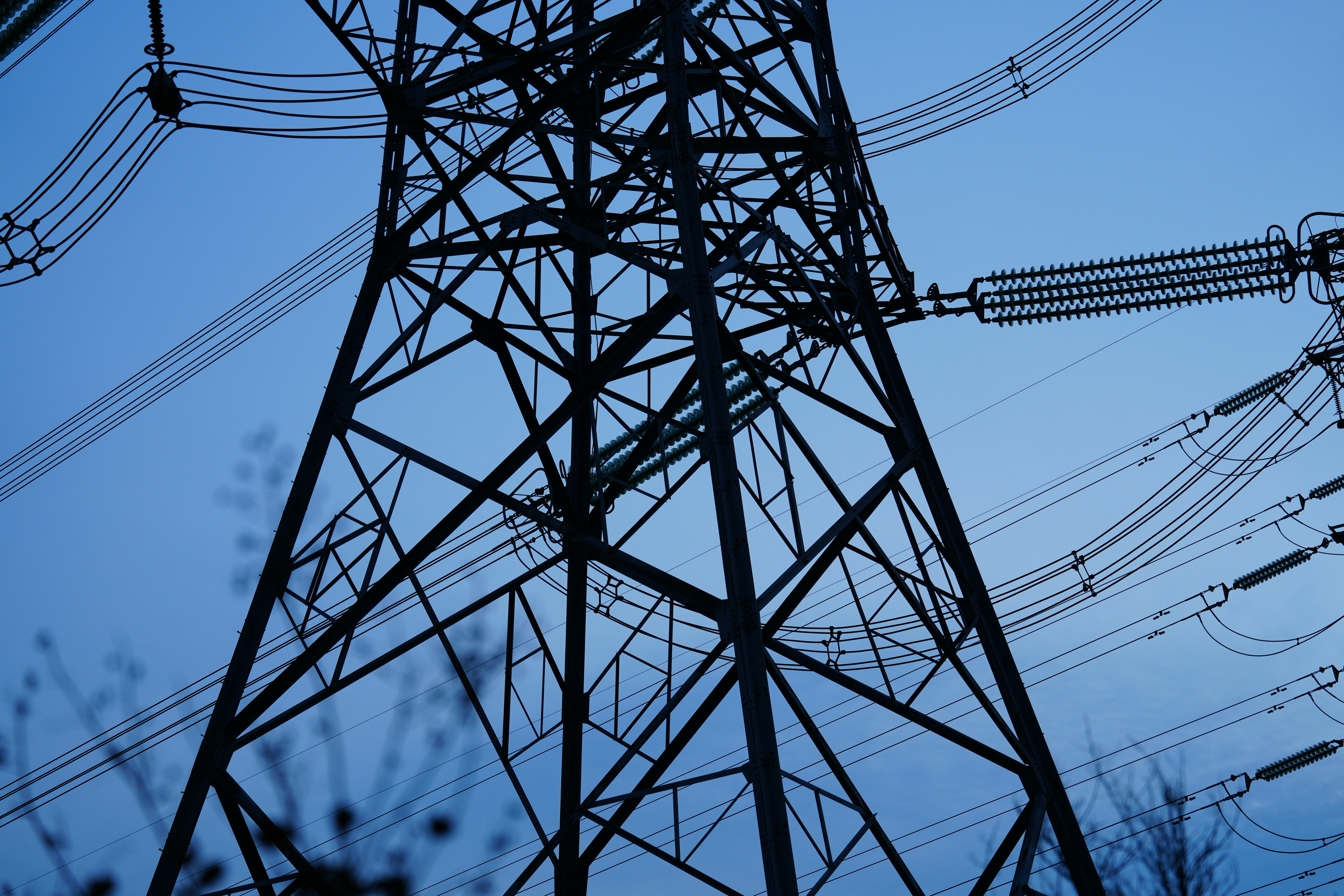 Steel Lattice Crowned by Cables Under a Clear Blue Sky