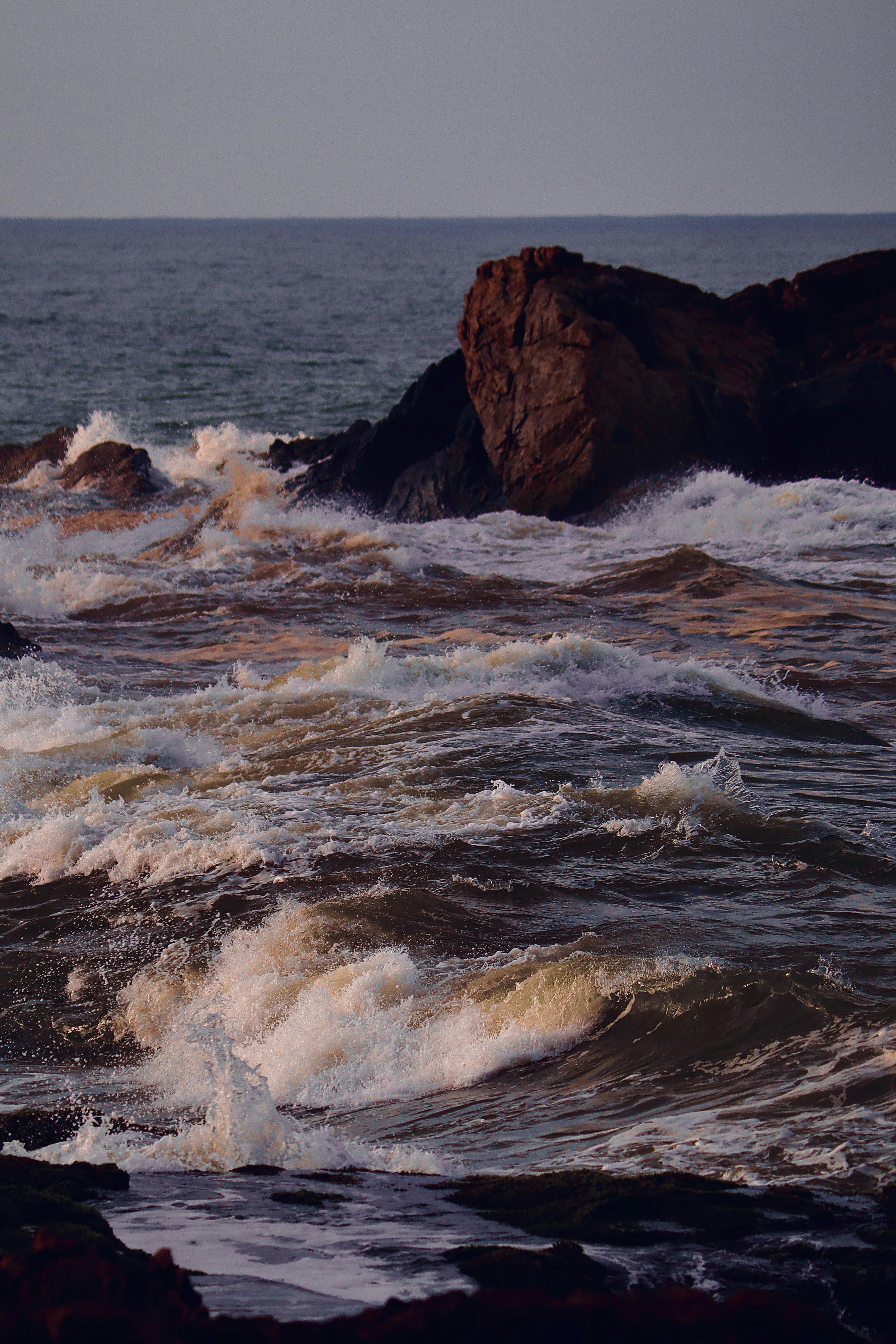 Rugged Ocean Crest over Windward Rocks at Dusk