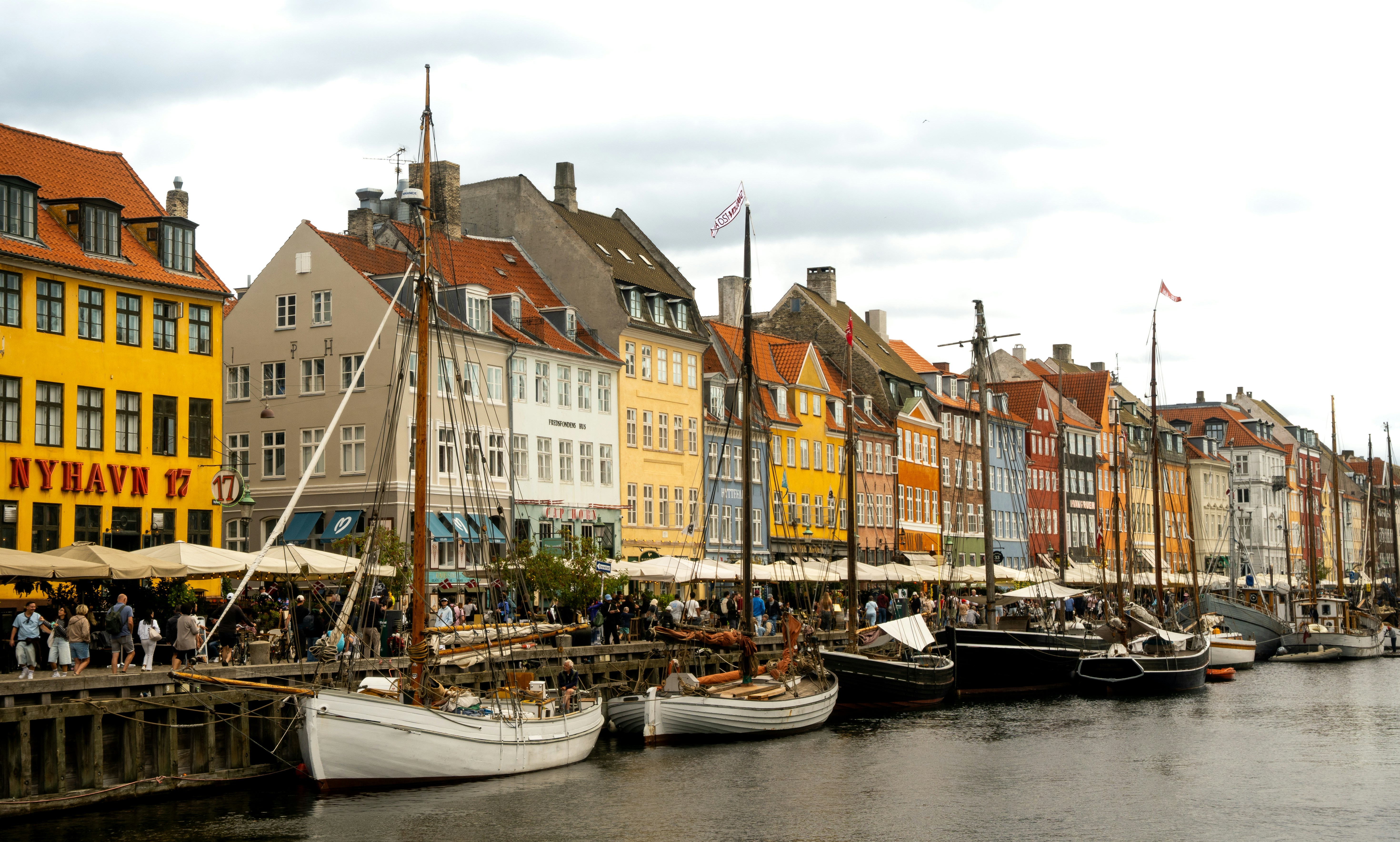 Colorful Nyhavn Row: Boats, Water, and Facades in Cadmium Light