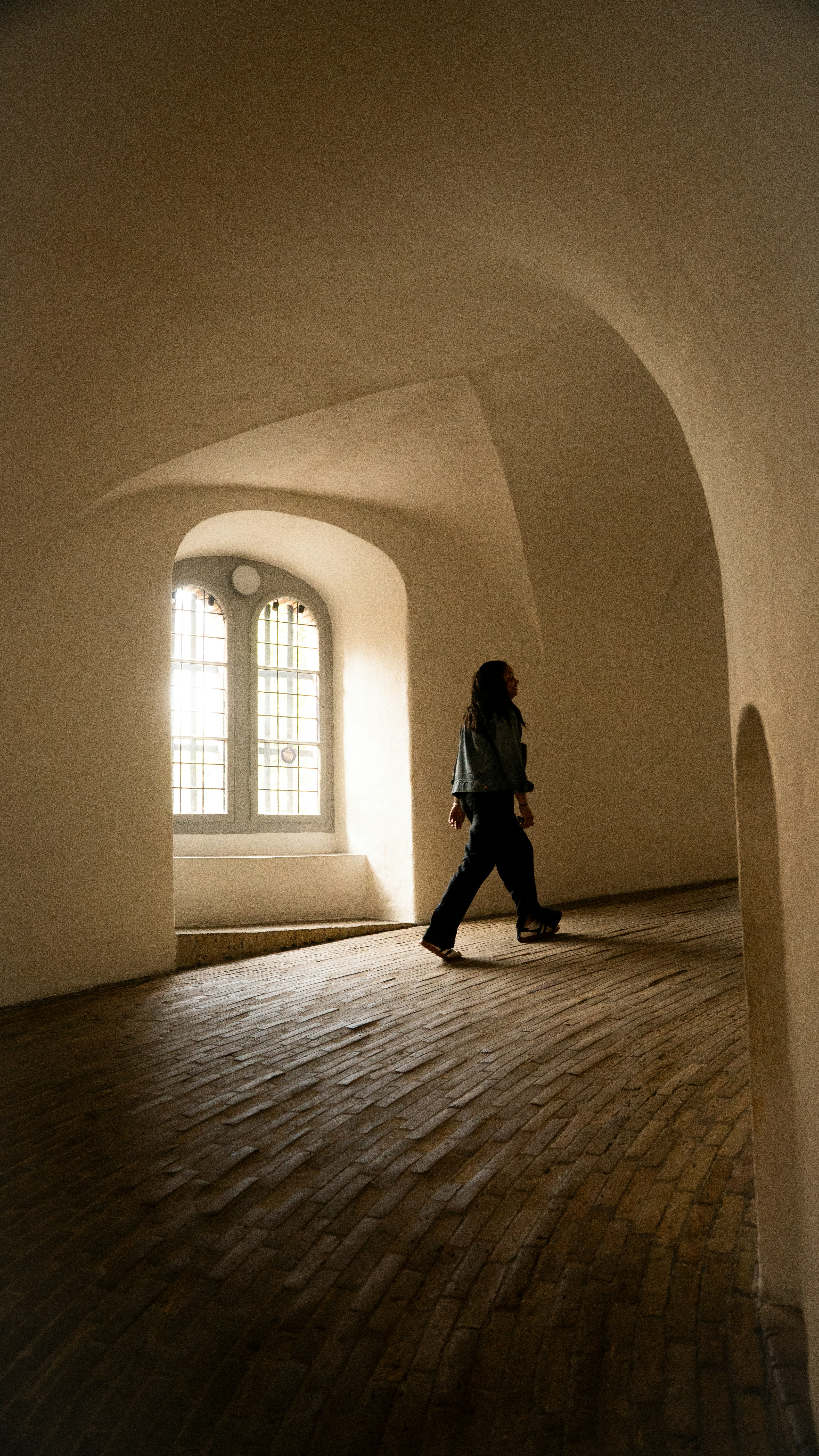 Footsteps in the Archway: A Quiet Walk Through Warm Light