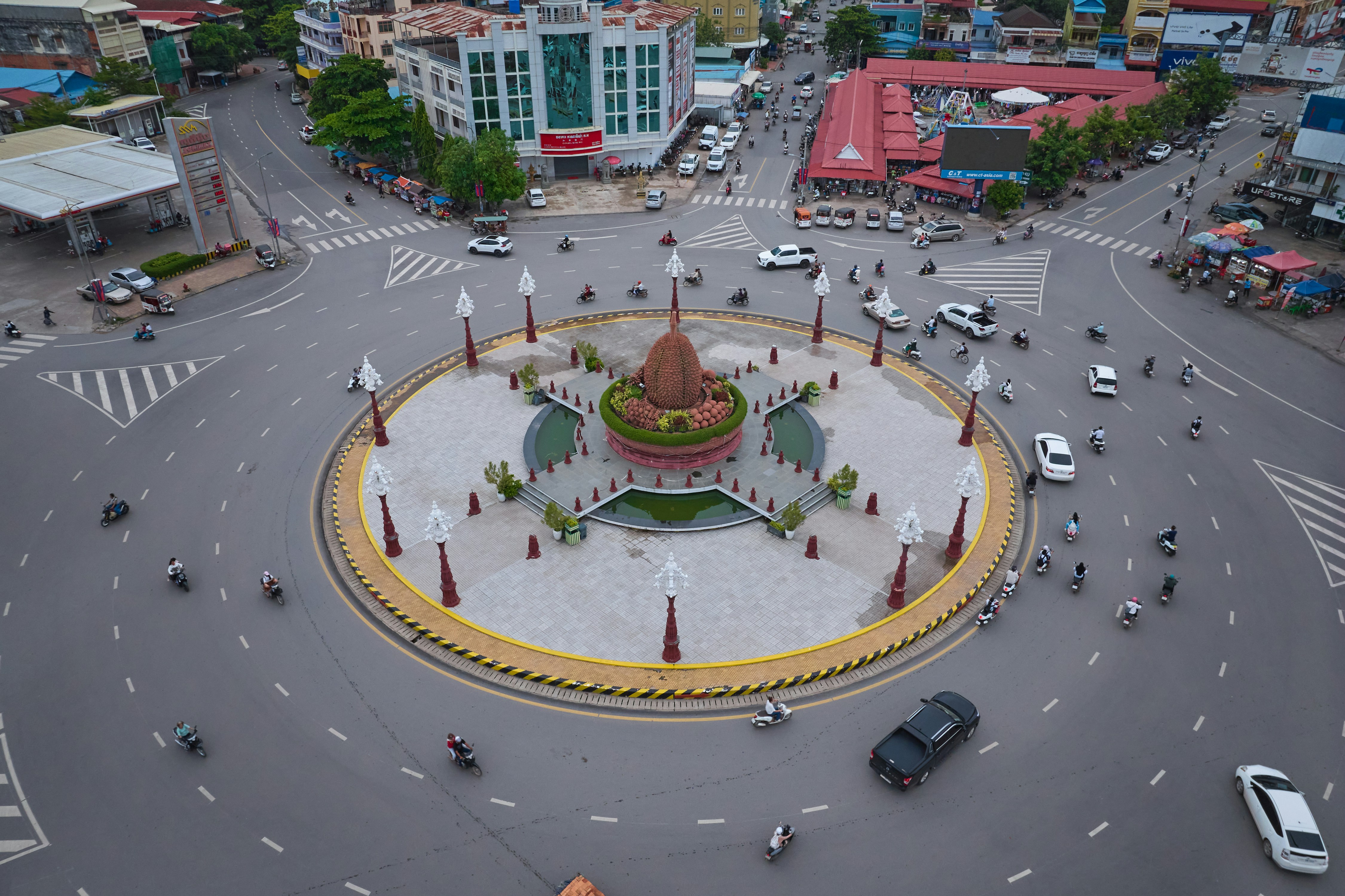 Circular roundabout shrine: aerial mis-en-scene of urban crossroads