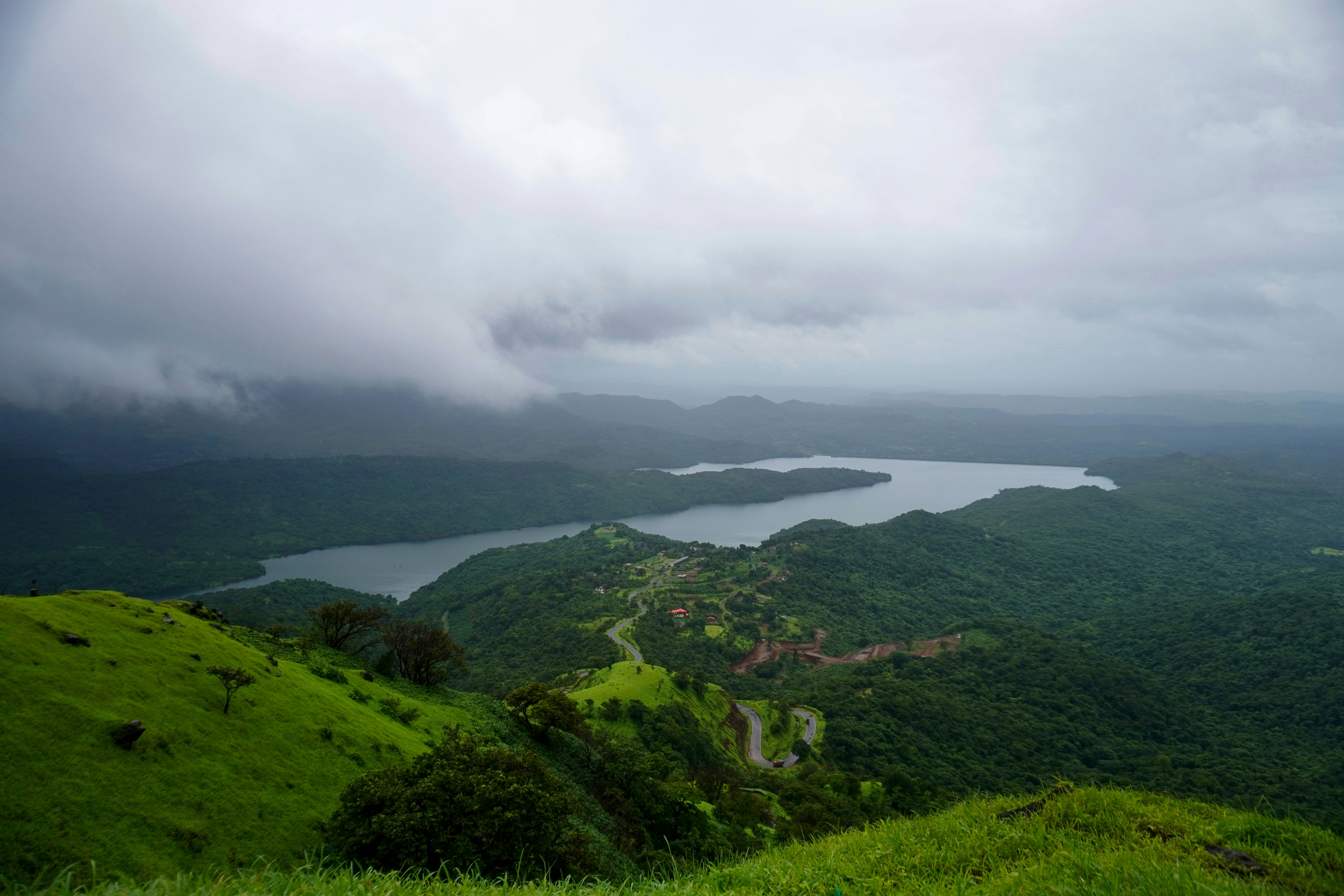 Emerald Hills Meet a Misty Lake Valley