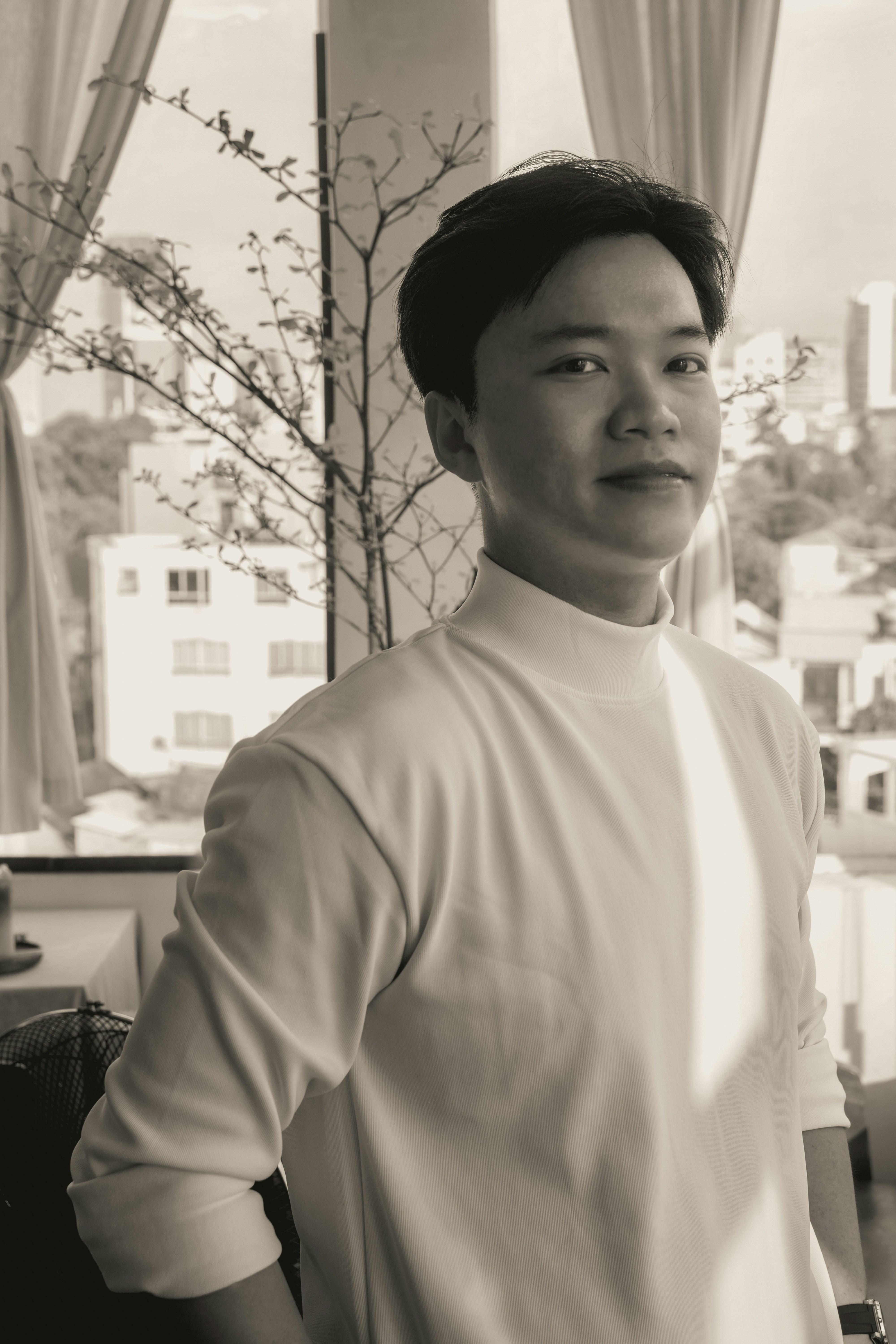 Portrait in Soft Sepia: A Gentle Presence by Window Light