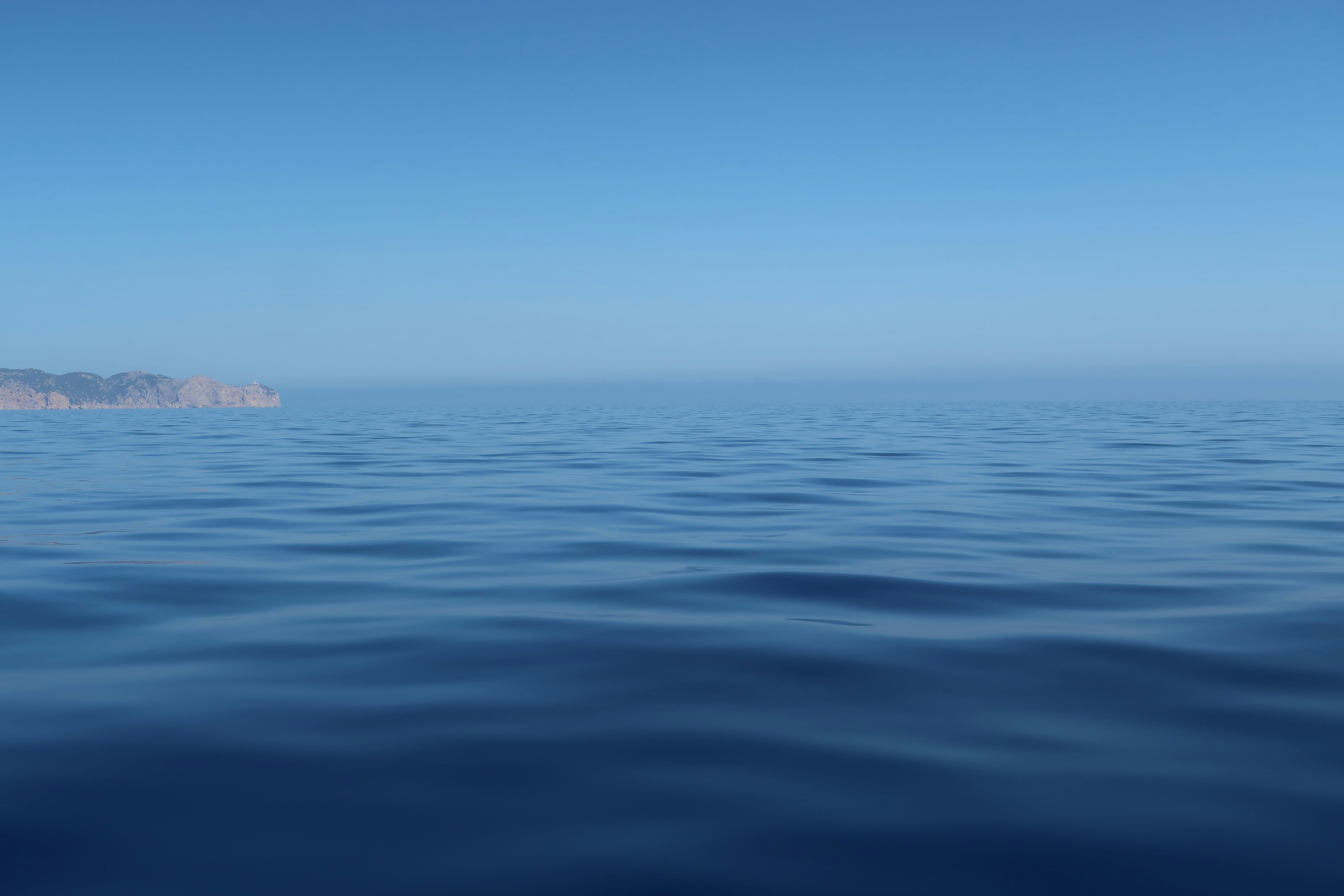 Horizon Quiet: A Calm Sea Meeting a Distant Shore