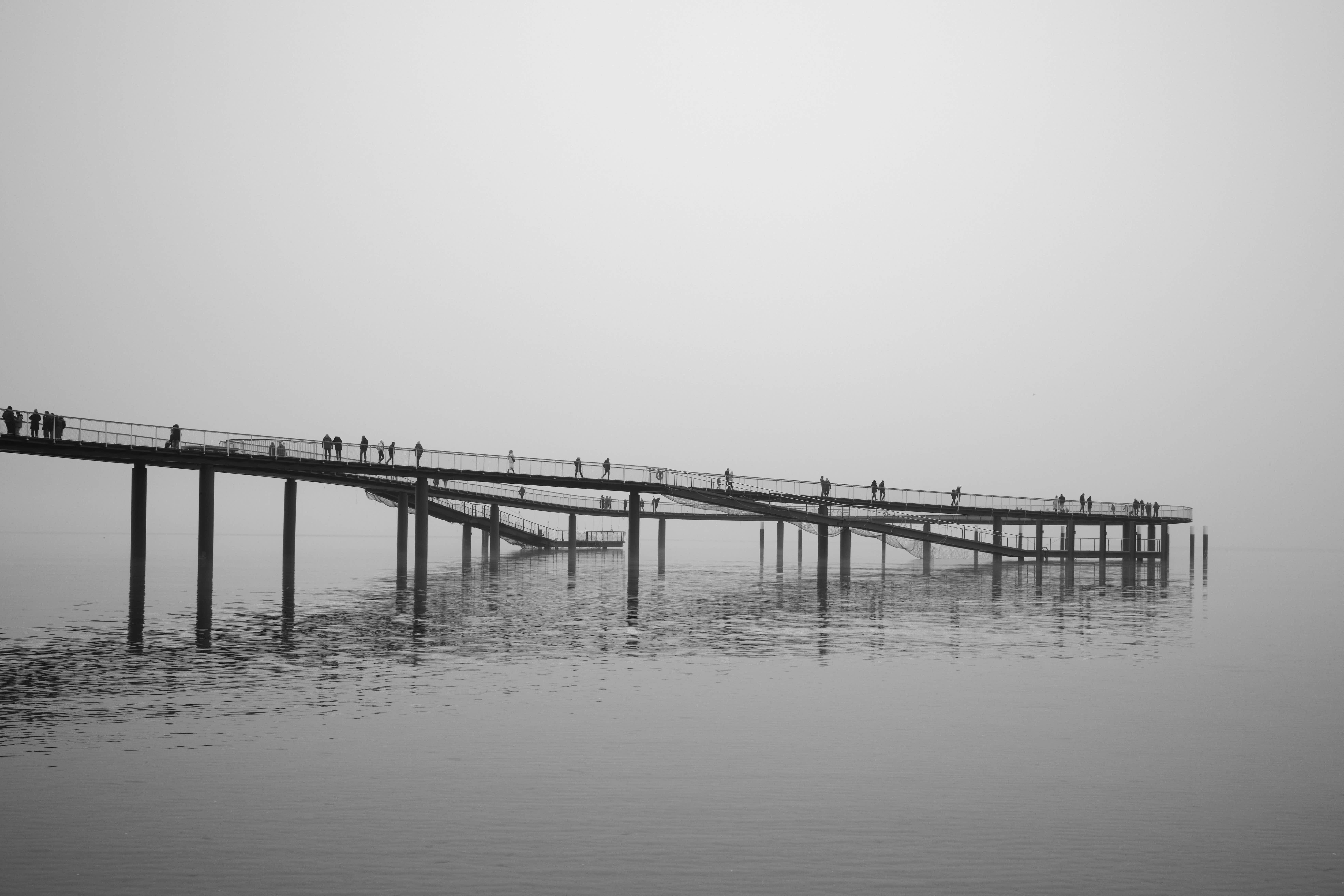 Lonely Walkway: A Quiet Pier Extending Into Mist