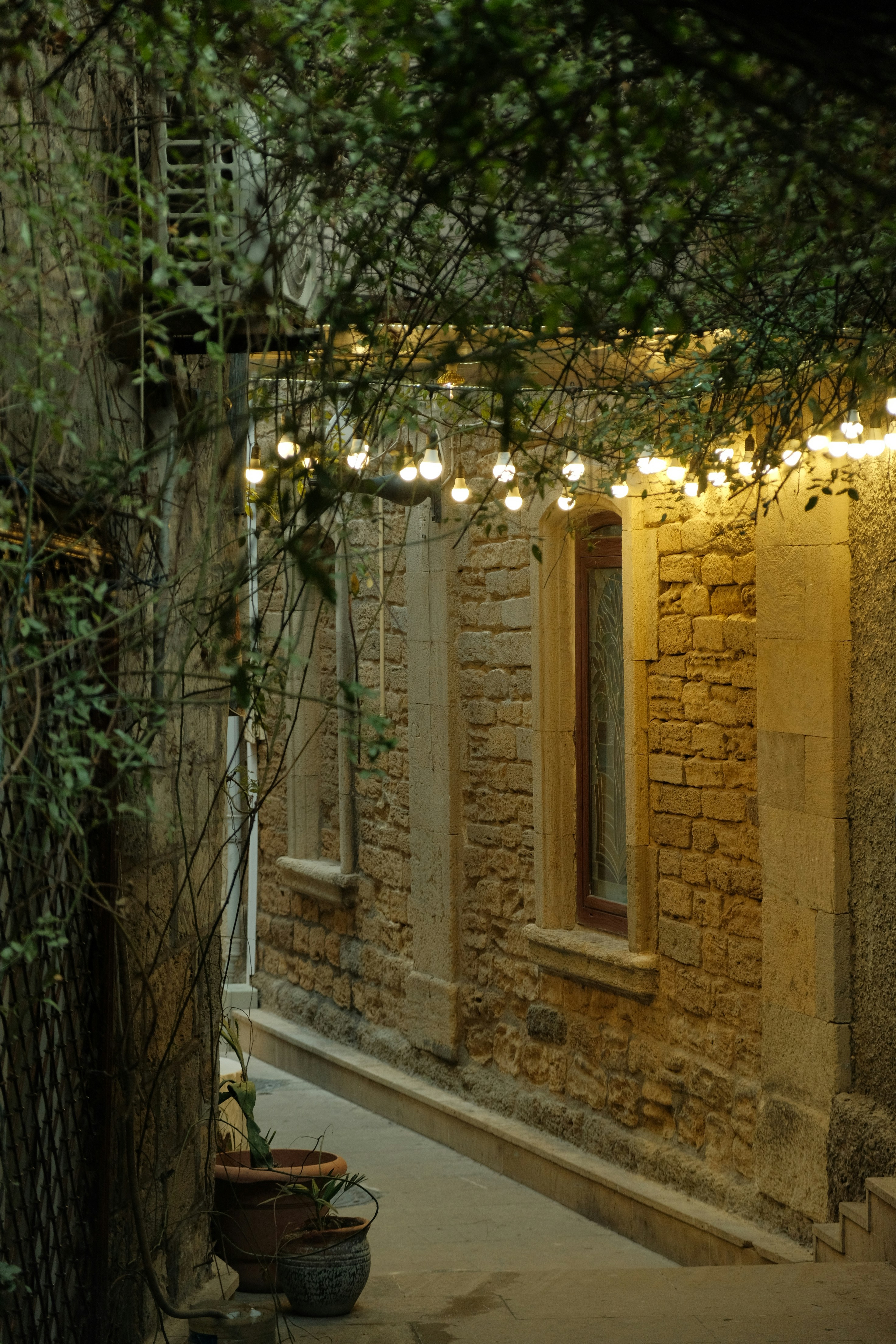 Warm Lanterns Along a Stone Alley