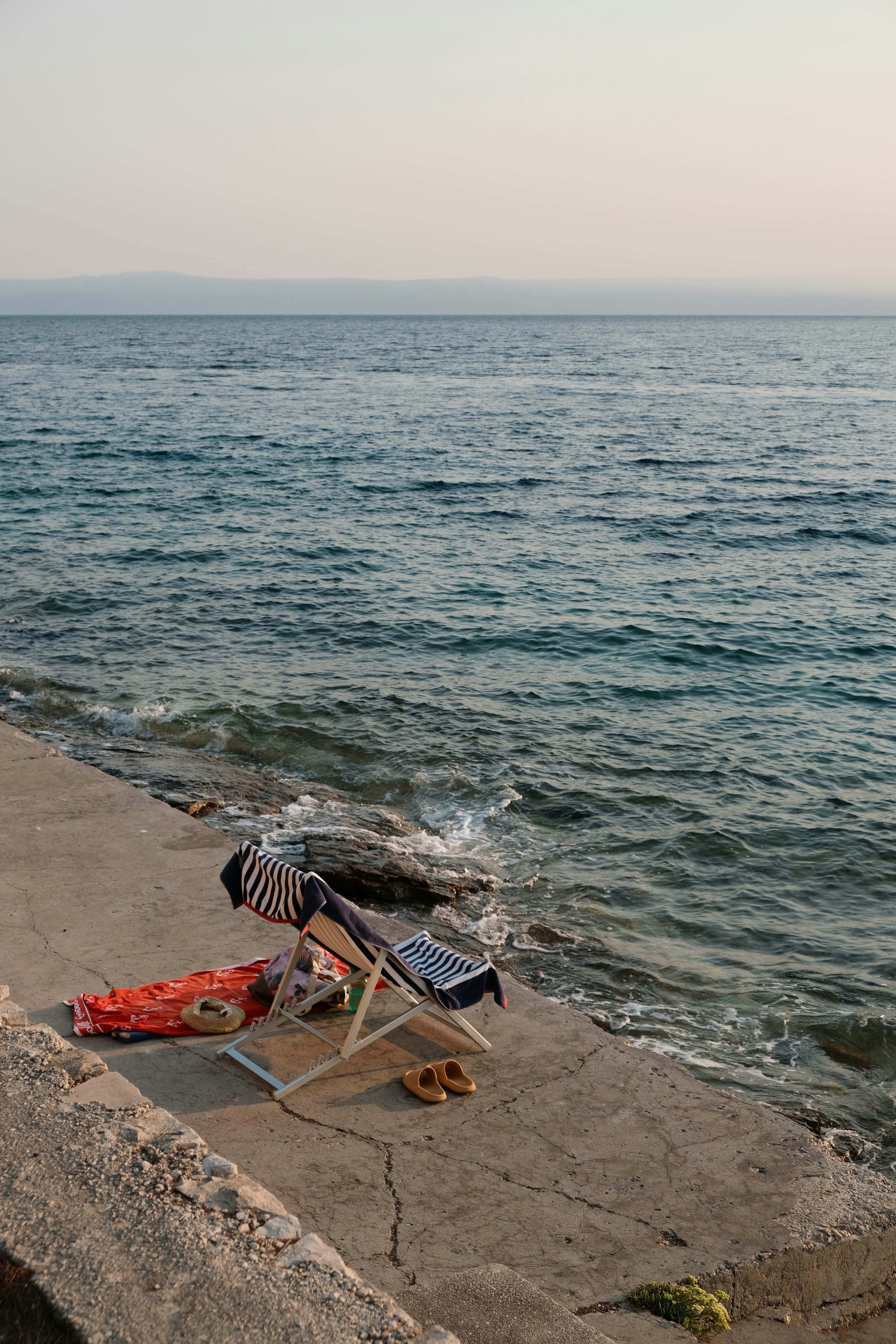 Shoreline Retreat: Beach Chairs Await the Evening Tide