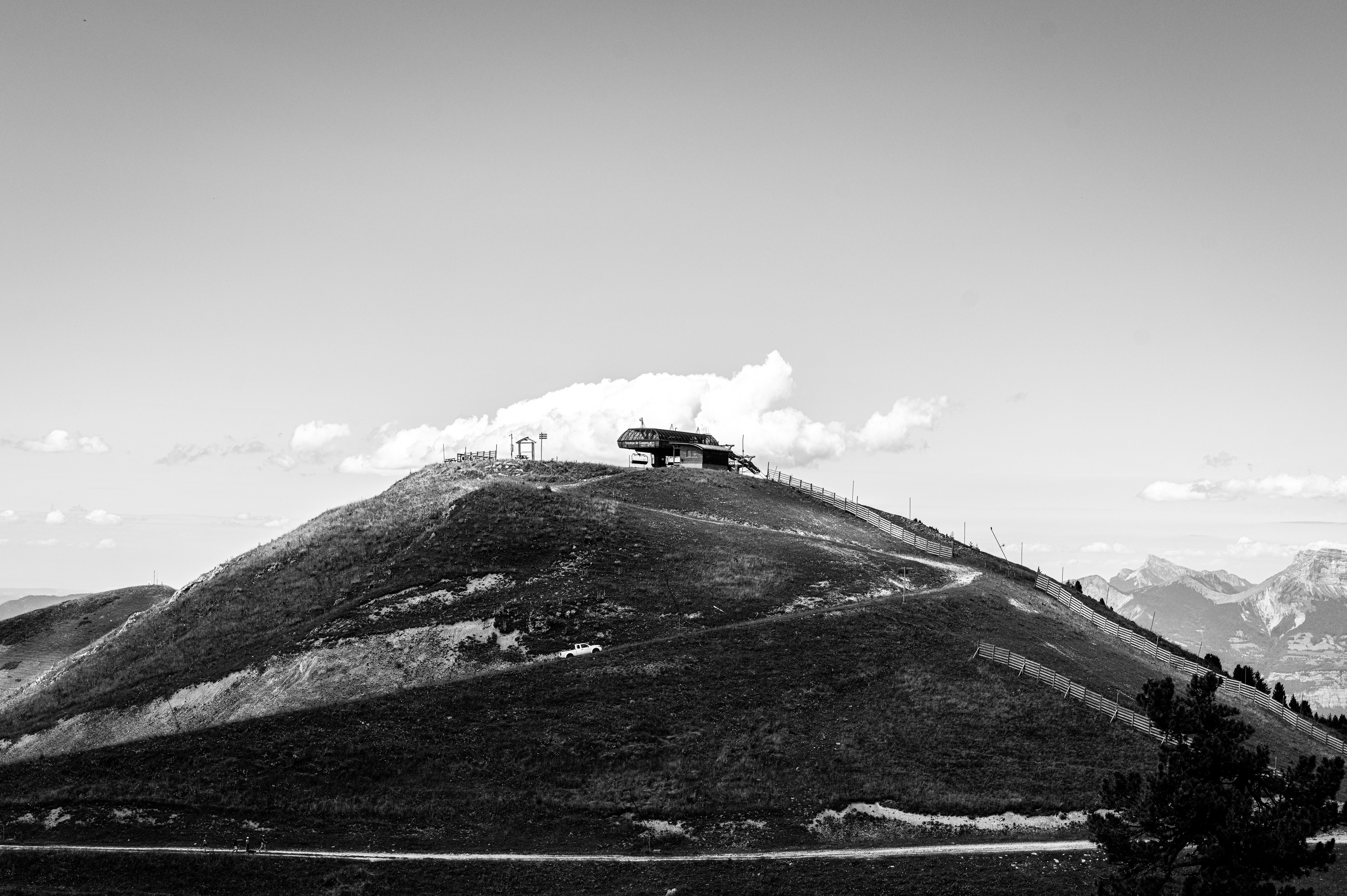 Hilltop Shelter Beneath a Whisper of Clouds