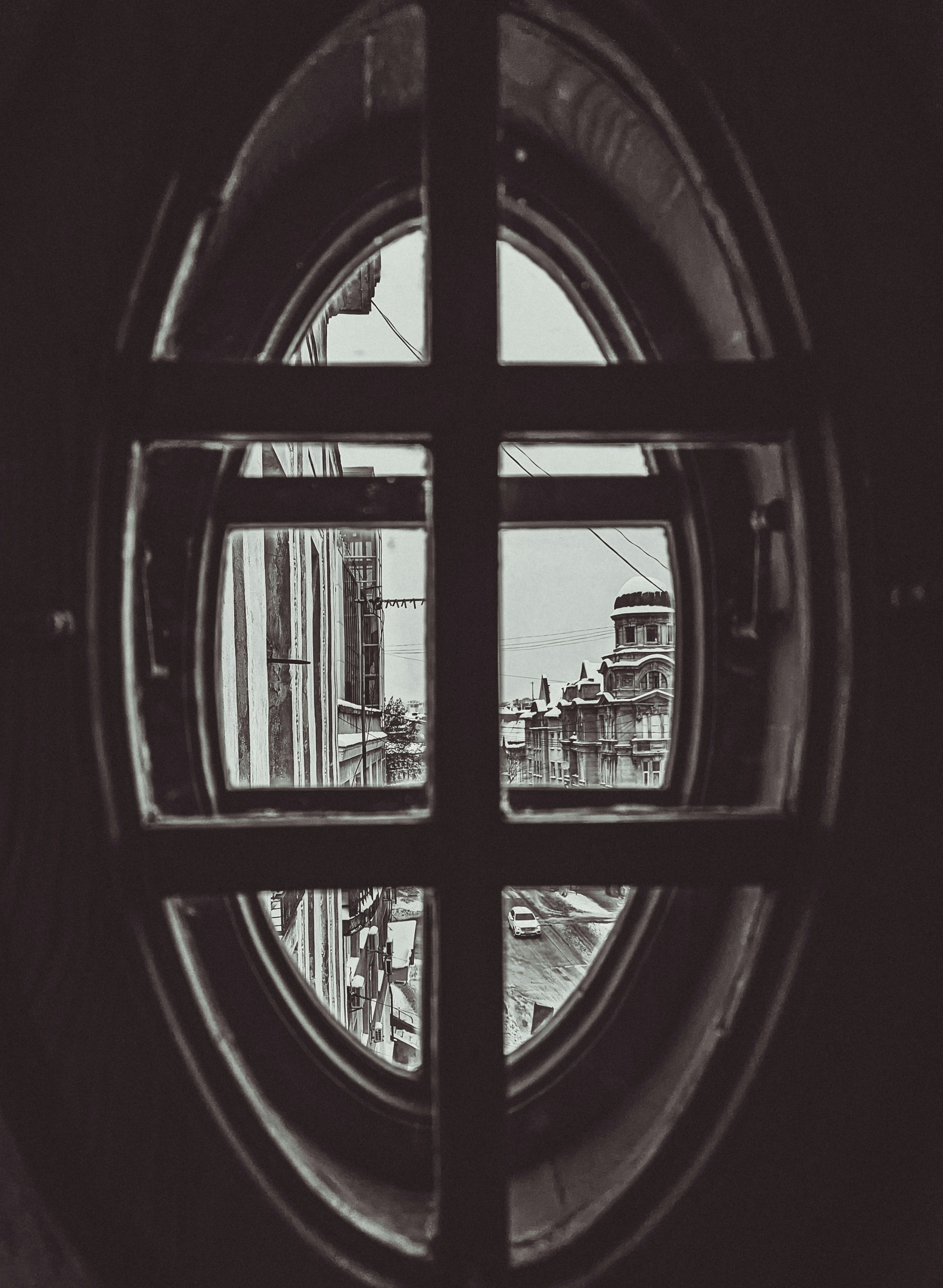 Crosshatched View: An Arcaded City Through a Victorian Window