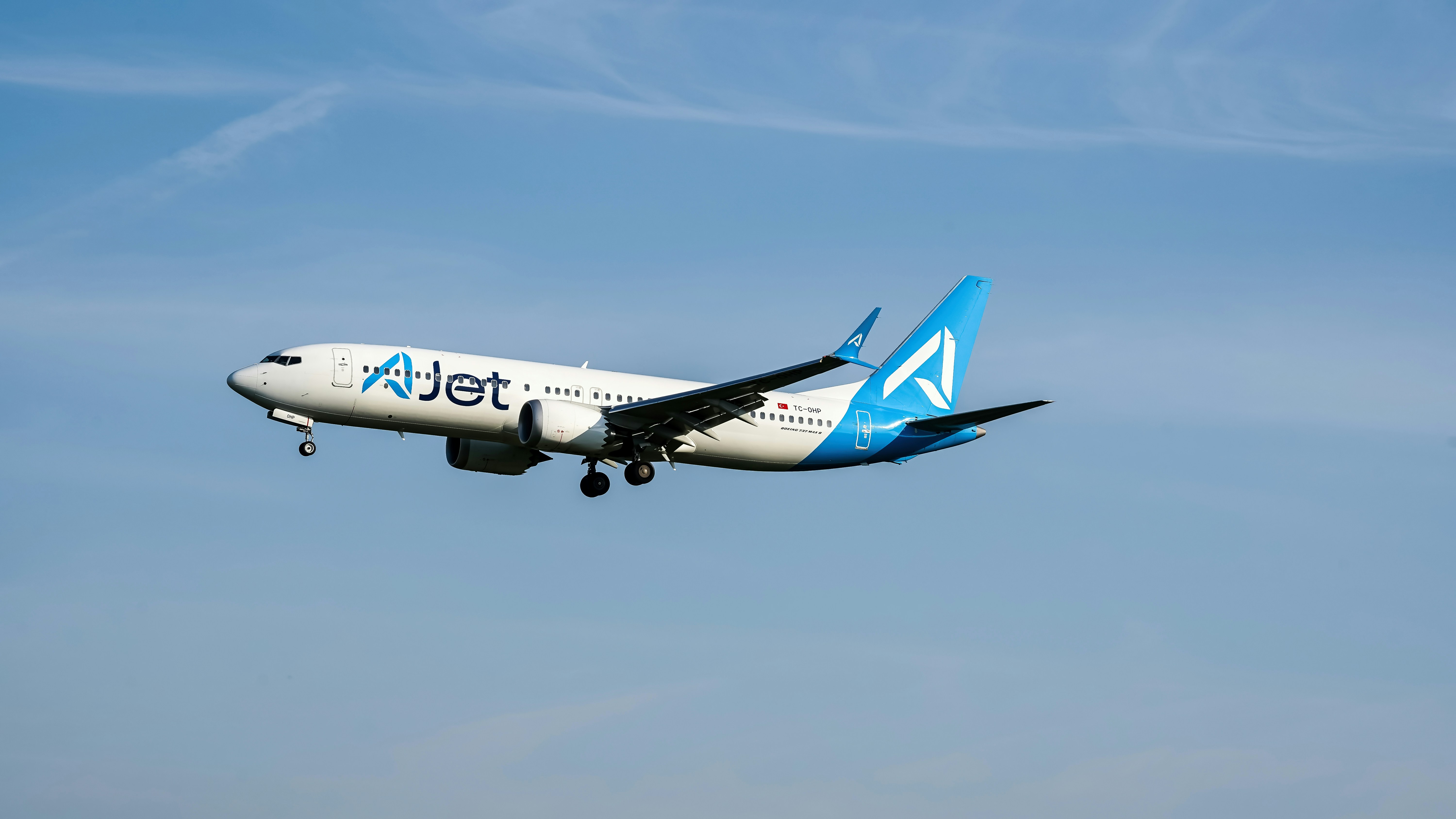 Jet in the Blue: An Airliner Ascends under a Clear Sky
