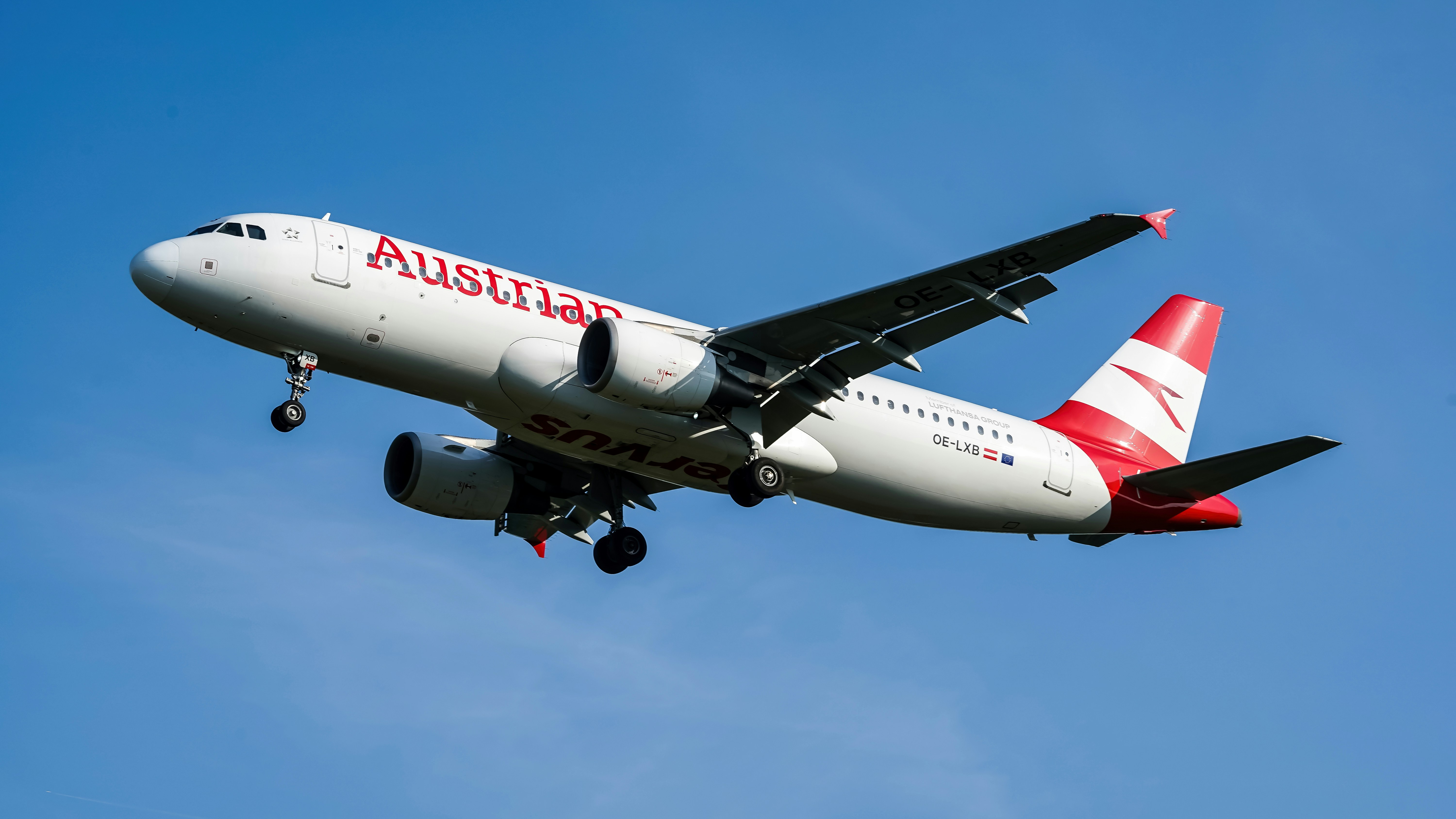 Ascending Austrian: An Airbus A320 in crisp blue sky