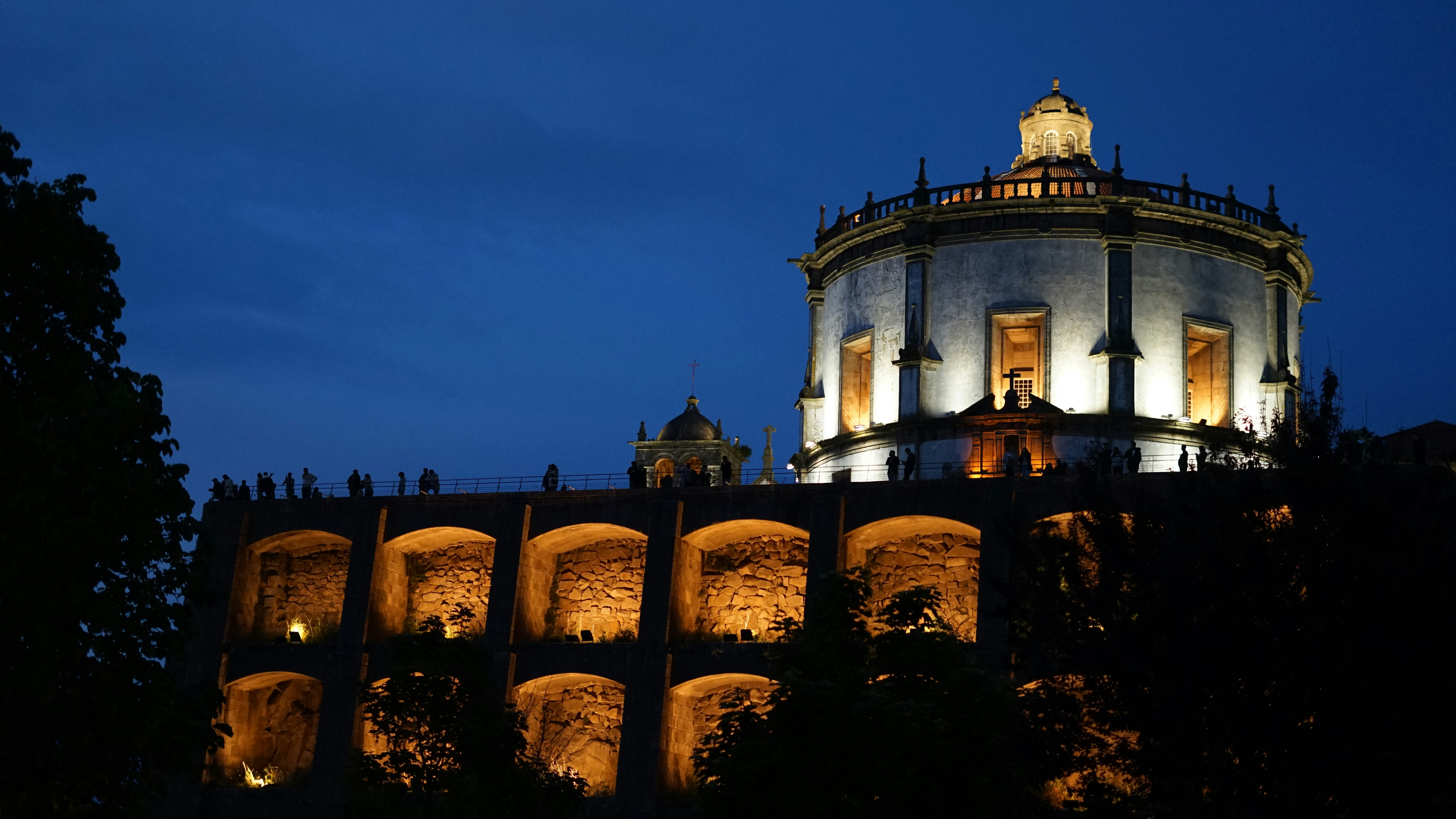 Moonlit Rotunda on a Terrace: Warm Glow Illuminates a Historic Edifice