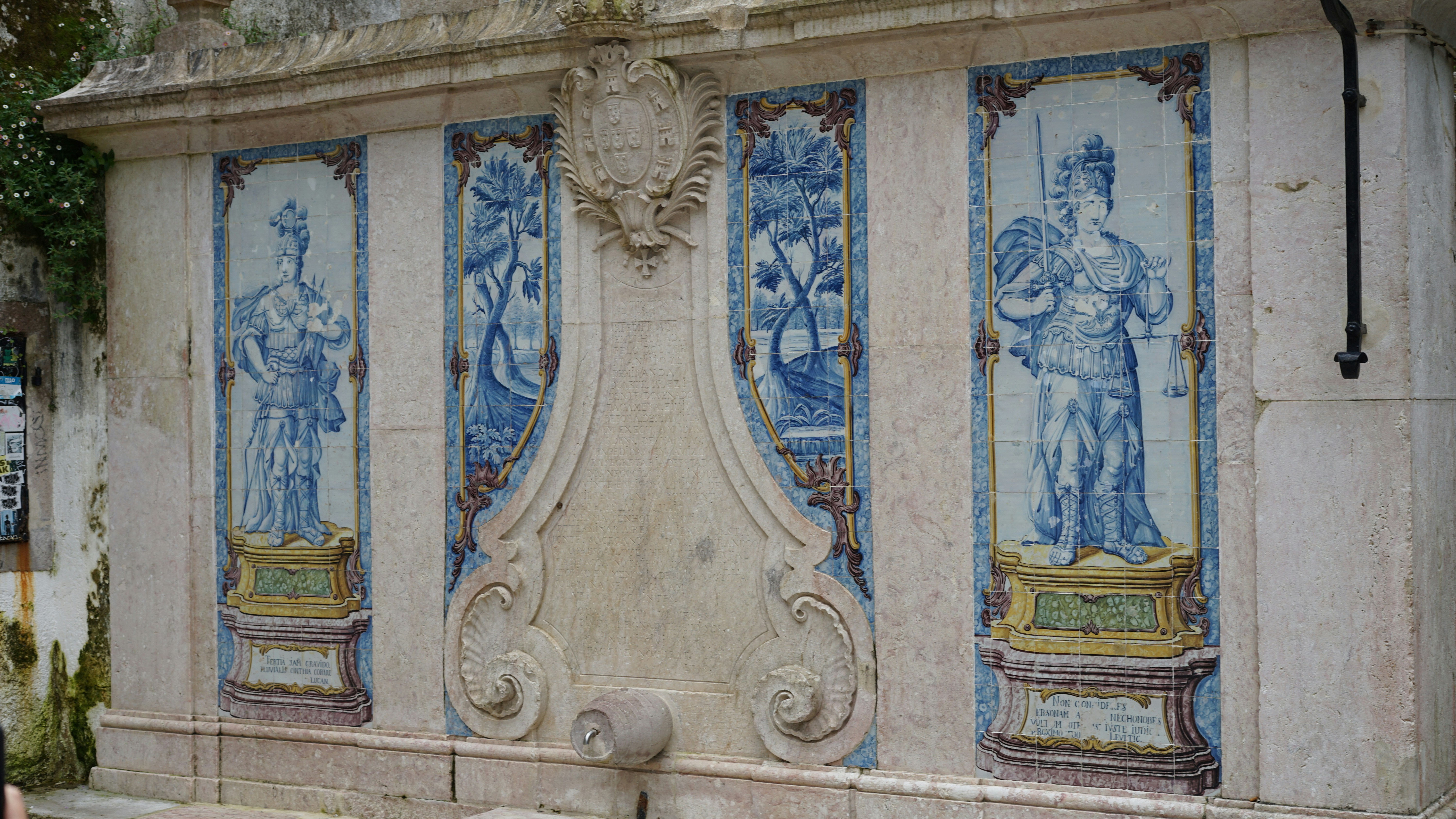 Azulejo Guardians: A Stone Fountain Framed by Masterful Tile Portraits