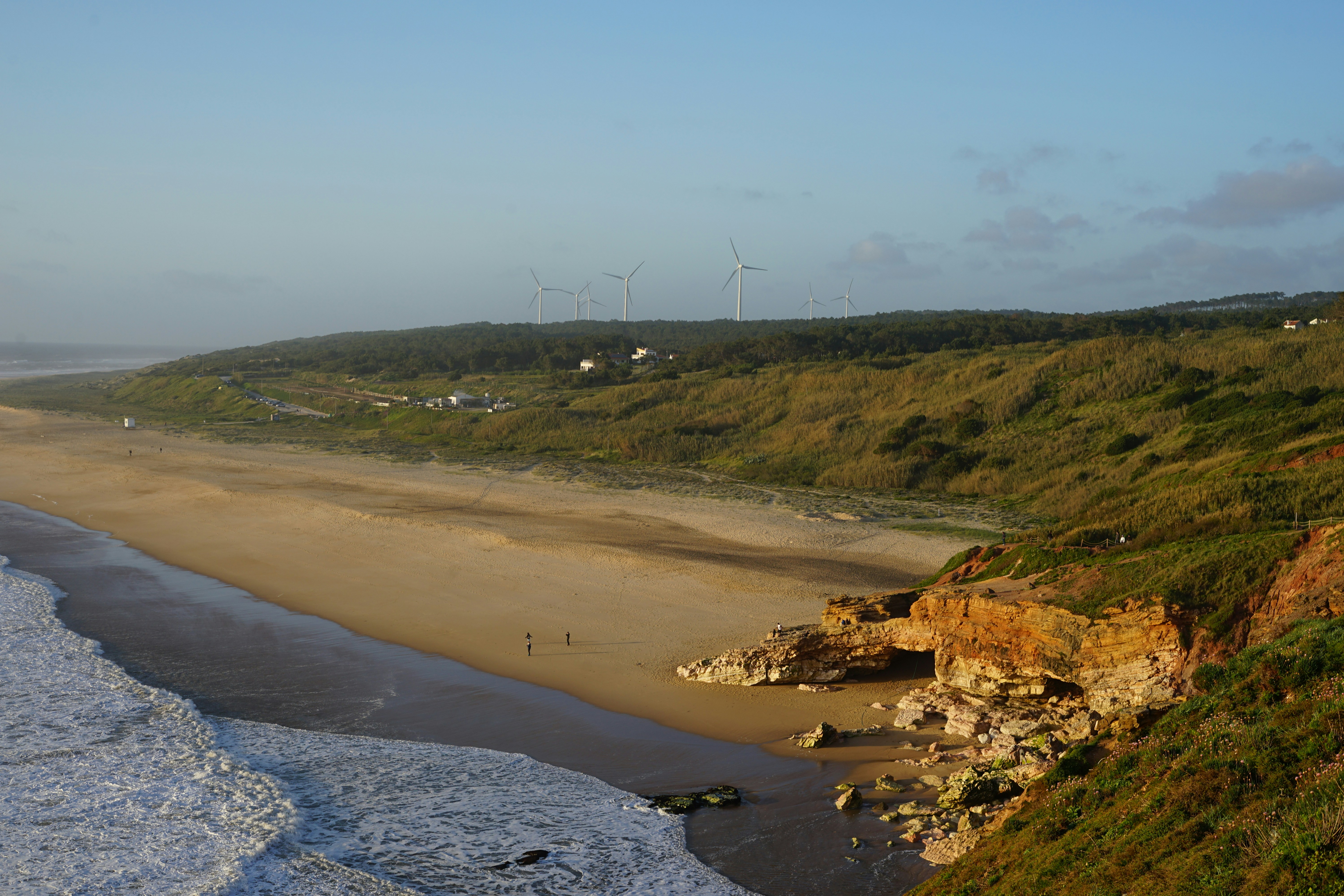 Coastal Cliffline with Wind Turbines under a Quiet Sky